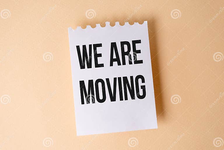 We are Moving Text on White Sticky Note on Yellow Background Stock ...