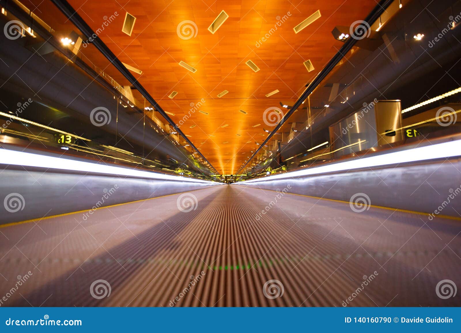 Illuminated Travelator And Directional Signs Stock Photography ...