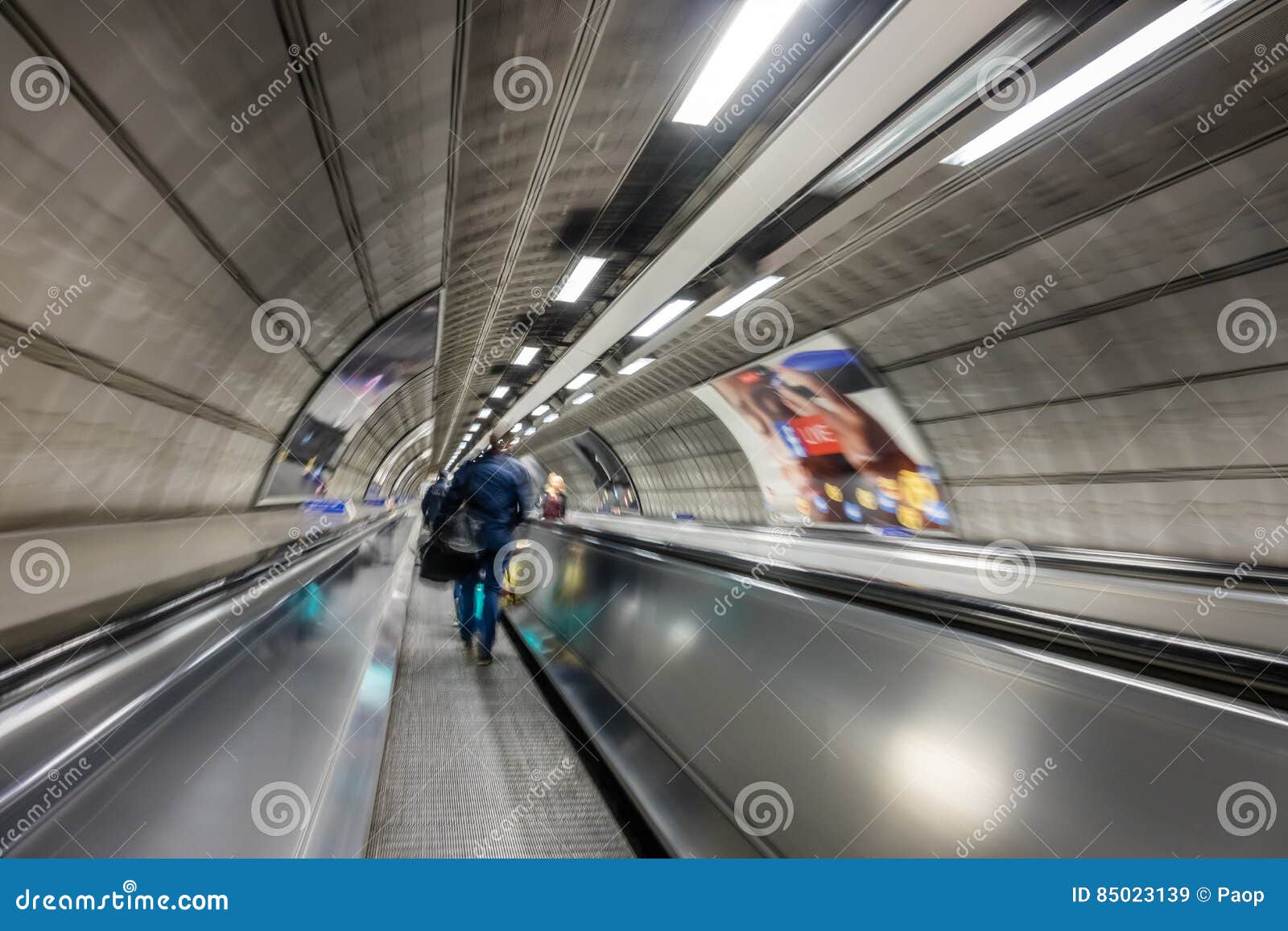 Moving walkway on tube editorial stock image. Image of person - 85023139