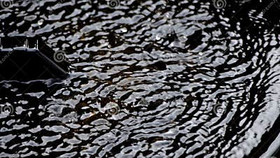 Water Drops Falling on a Large Puddle Stock Photo - Image of surface ...