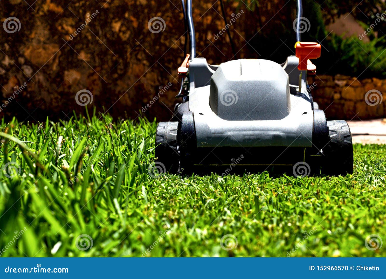 The mower on a grass editorial image. Image of lawn - 152966570