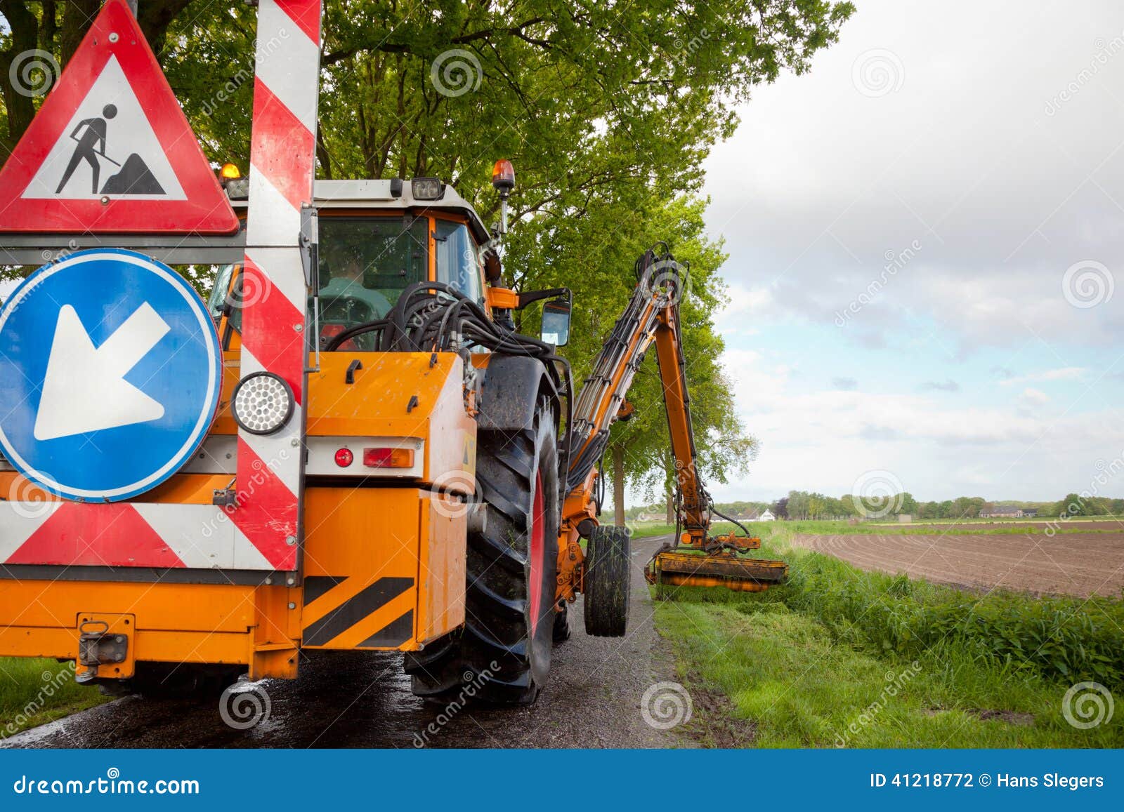 Mowing grass shoulder stock photo. Image of equipment - 41218772