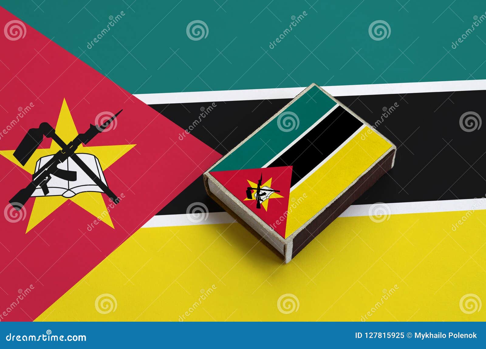 Mozambique Flag is Pictured on a Matchbox that Lies on a Large Flag ...