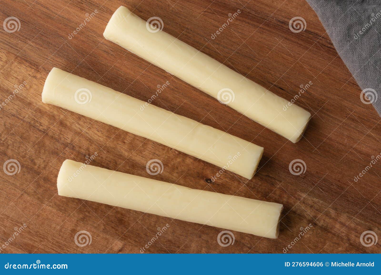 Mozzarella String Cheese on Cutting Board Stock Photo - Image of macro ...