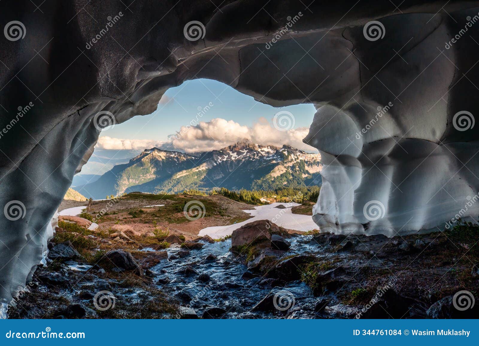 Views of Mountains through an Ice Cave at Mt. Rainier National Park in ...