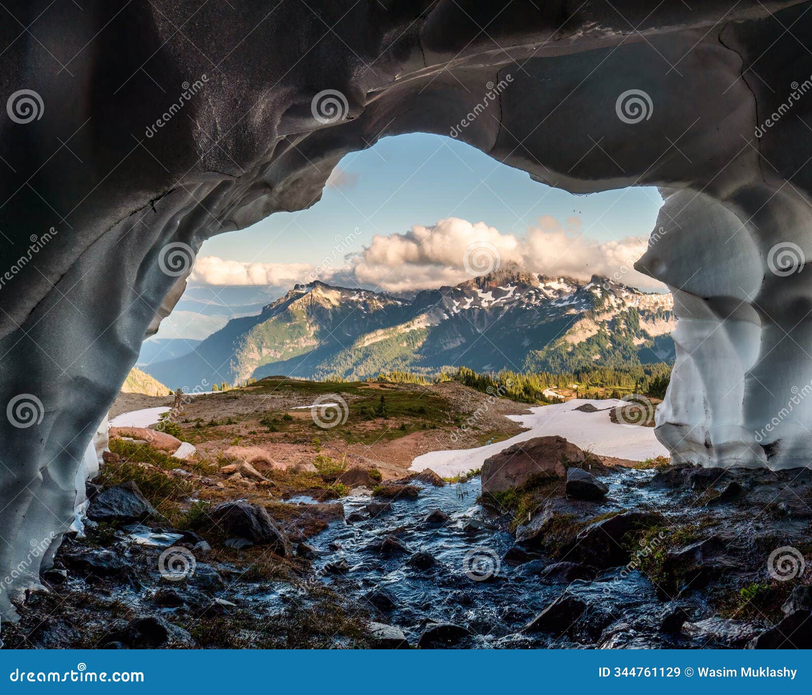 Views of Mountains through an Ice Cave at Mt. Rainier National Park ...