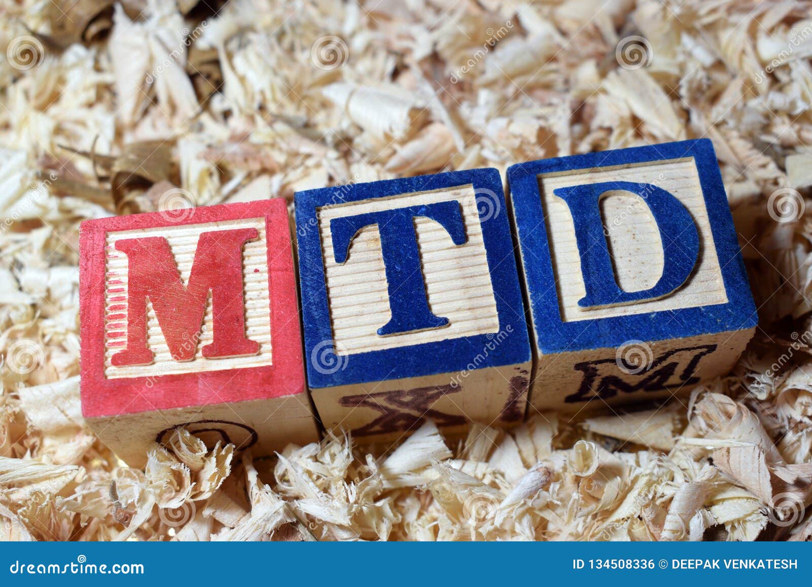 MTD text on wooden block stock photo. Image of date - 134508336