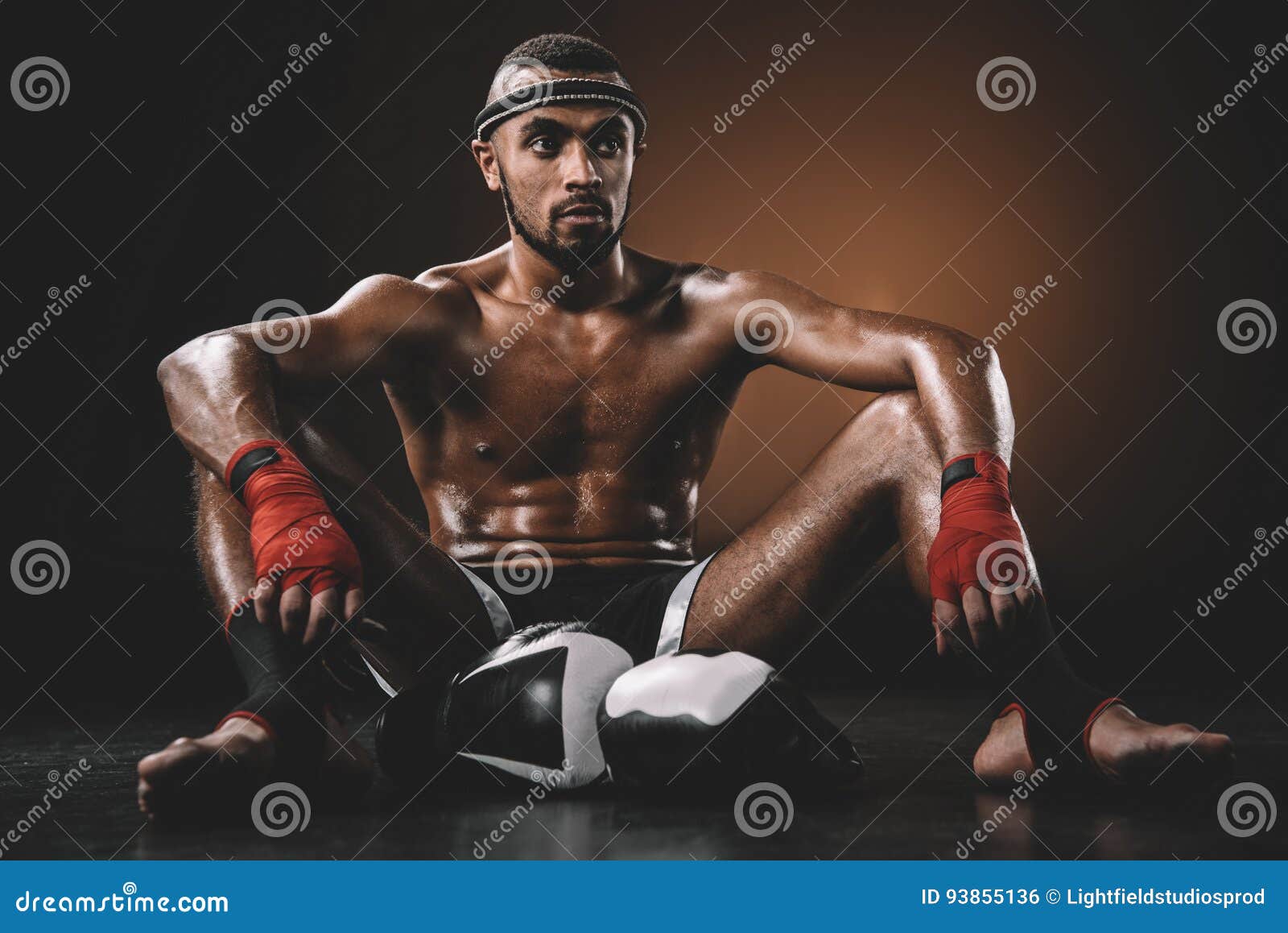 Muay Thai Fighter with Mongkhon on Head Sitting on Floor Stock Photo ...