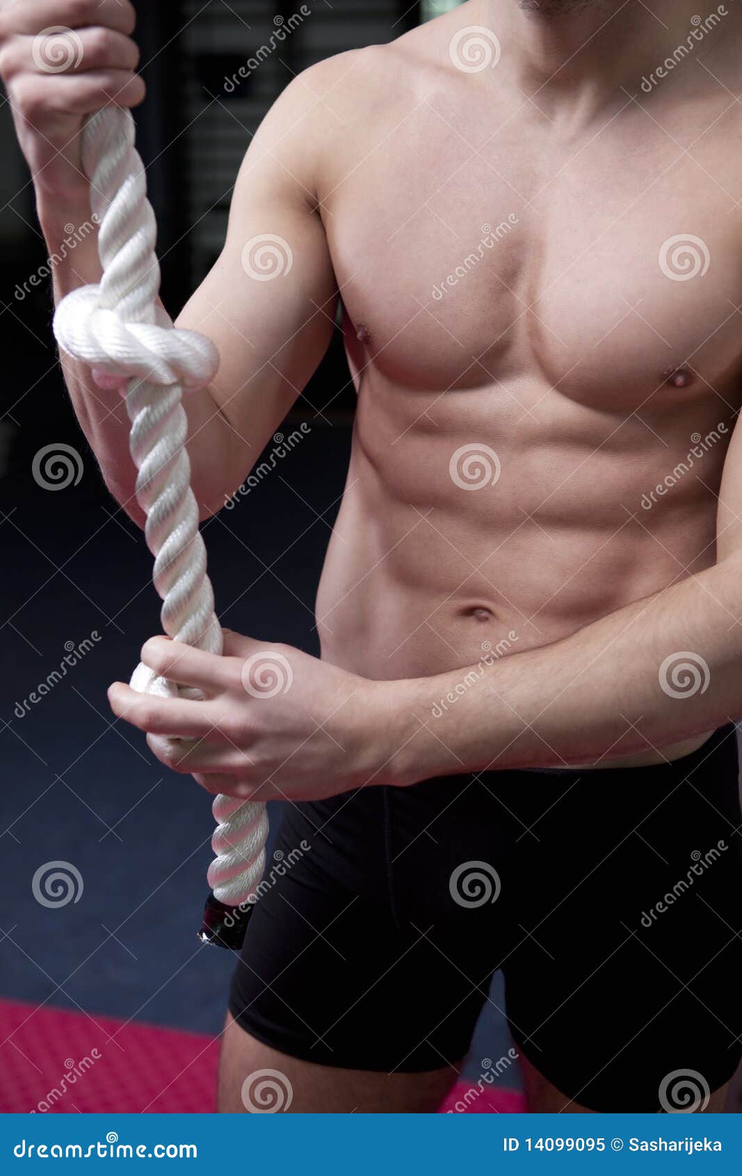 Mucle man with rope stock image. Image of handsome, male - 14099095