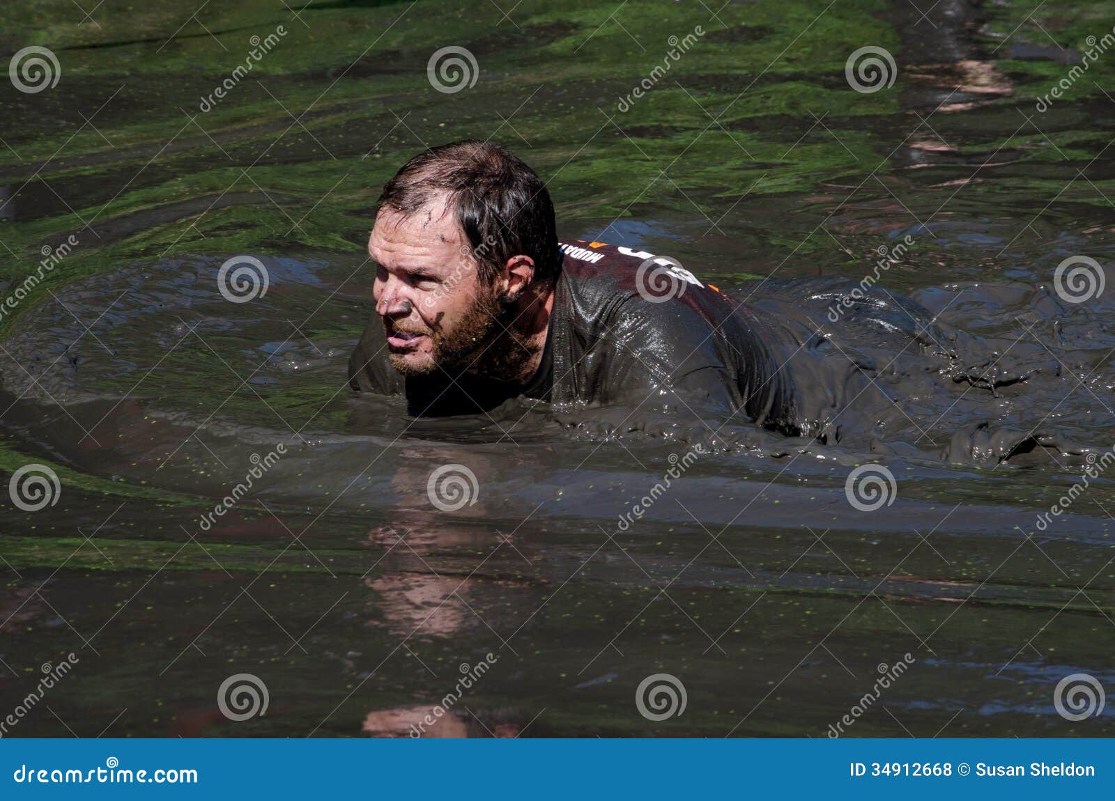 Mud crawl editorial stock photo. Image of dirt, person - 34912668