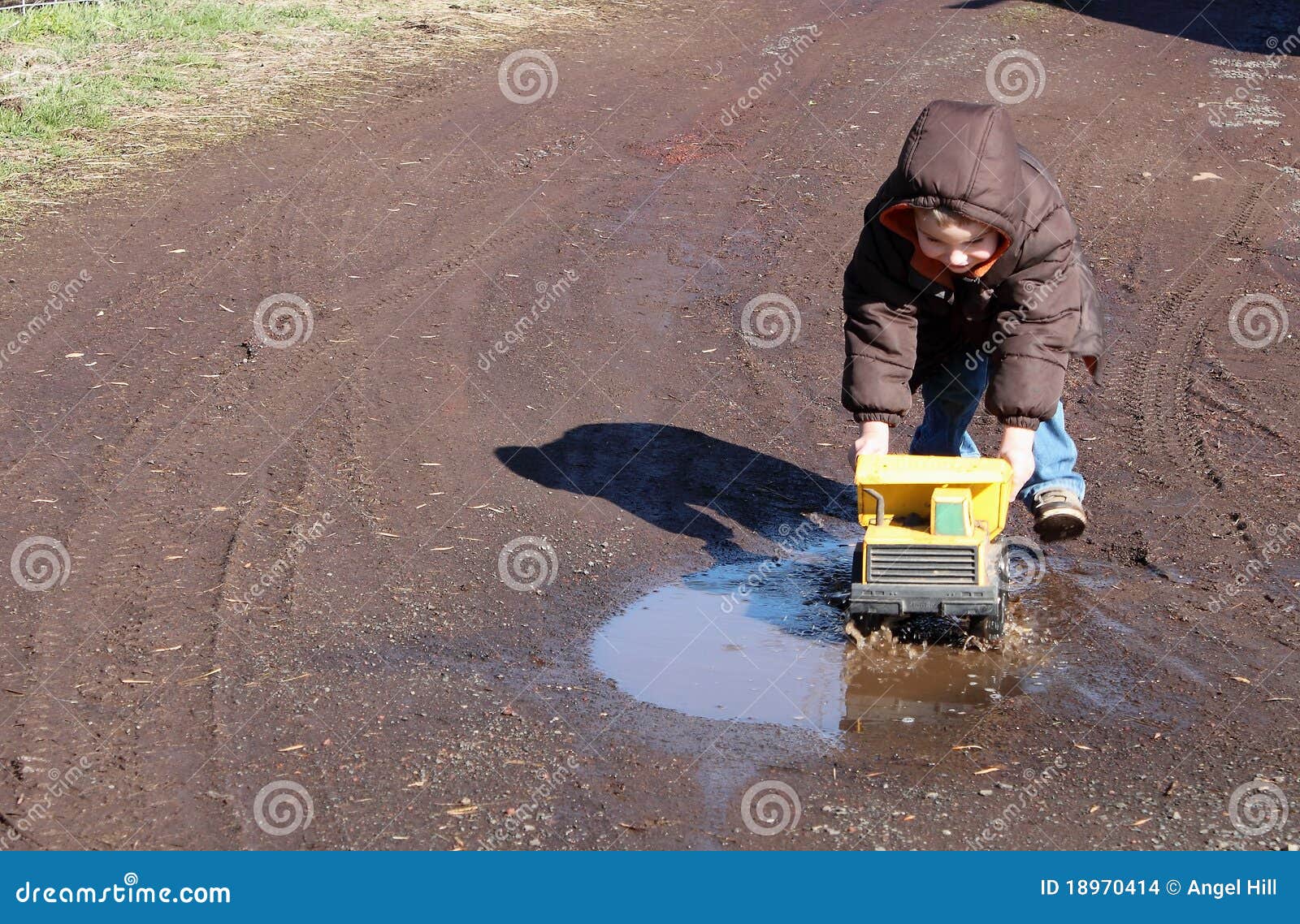 Mud Puddle Fun stock photo. Image of playtime, pushing - 18970414