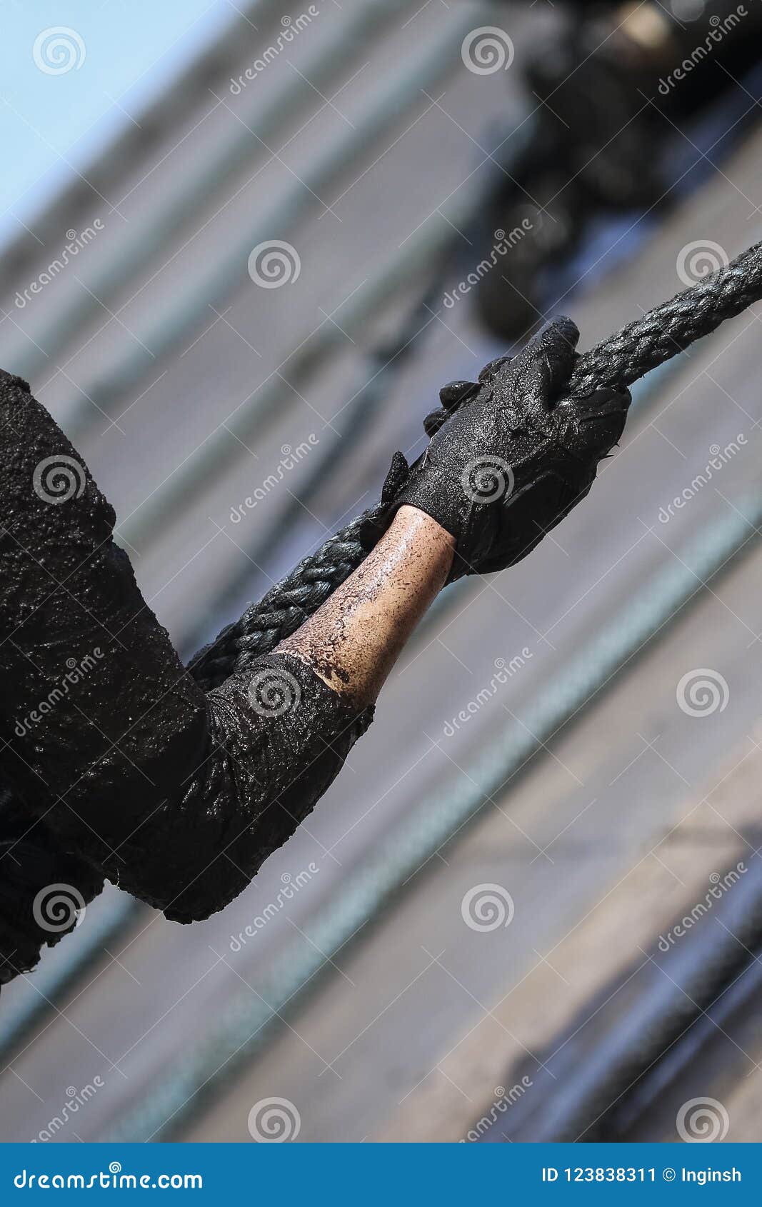 Mud Race Runners,defeating Obstacles by Using Rope Stock Image - Image ...
