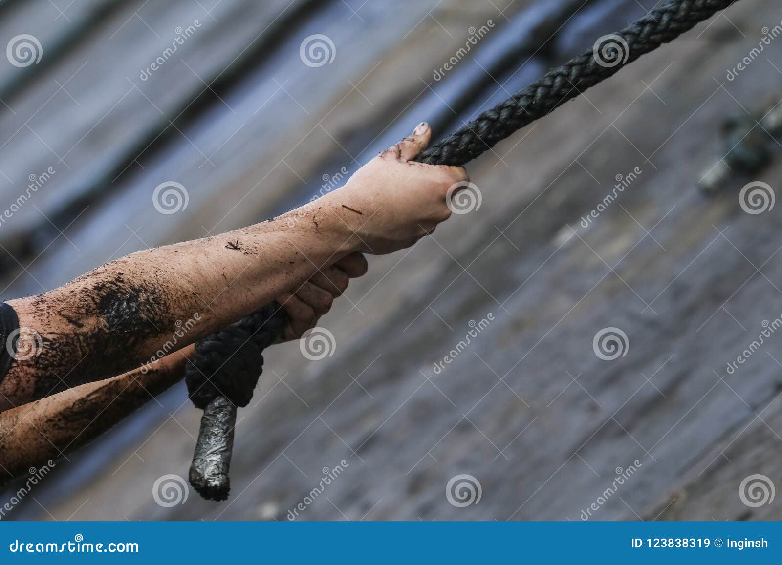 Mud Race Runners, Defeating Obstacles By Using Rope Royalty-Free Stock ...