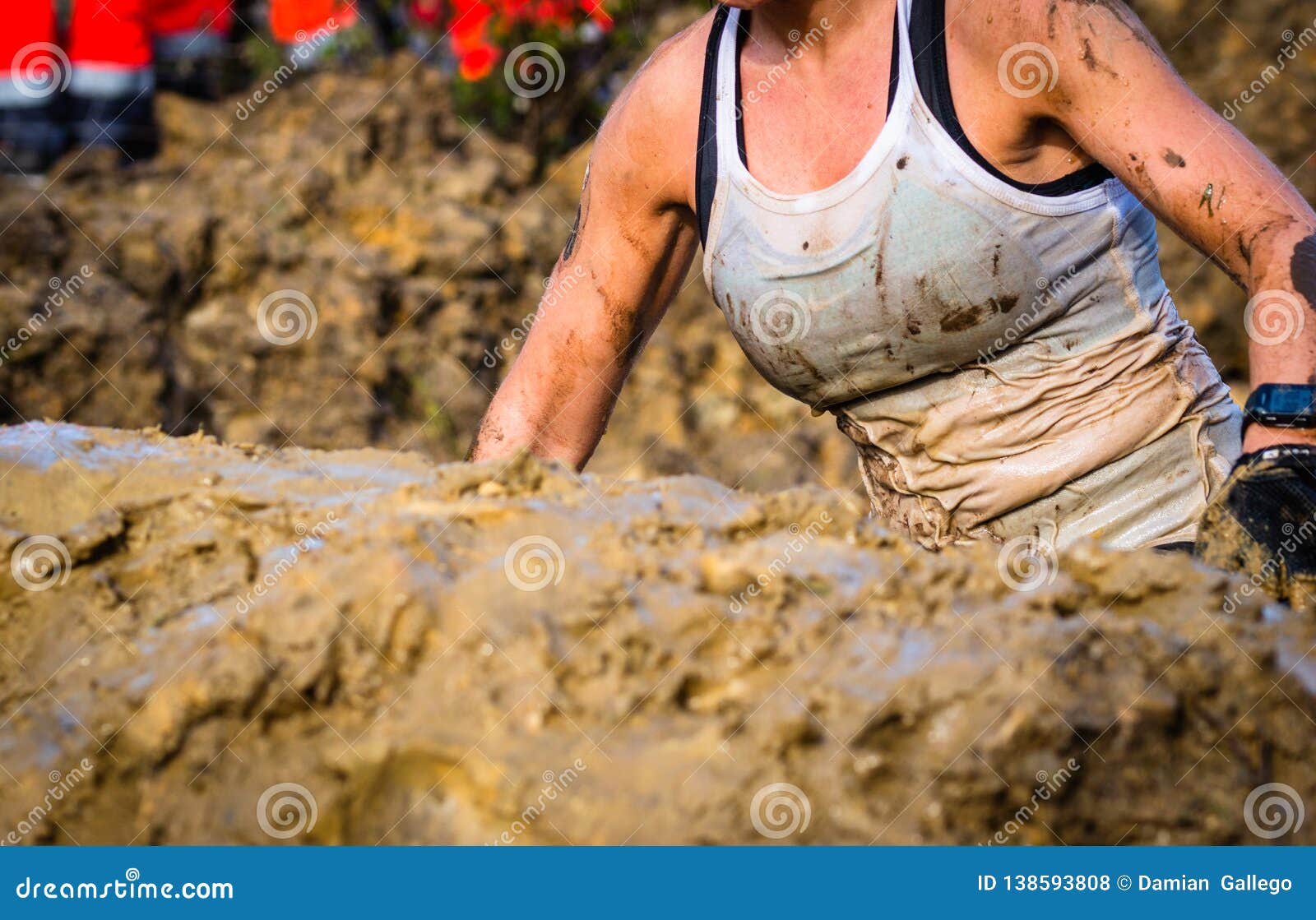 Mud Race Runners, Defeating Obstacles by Using Ropes. Editorial Stock ...