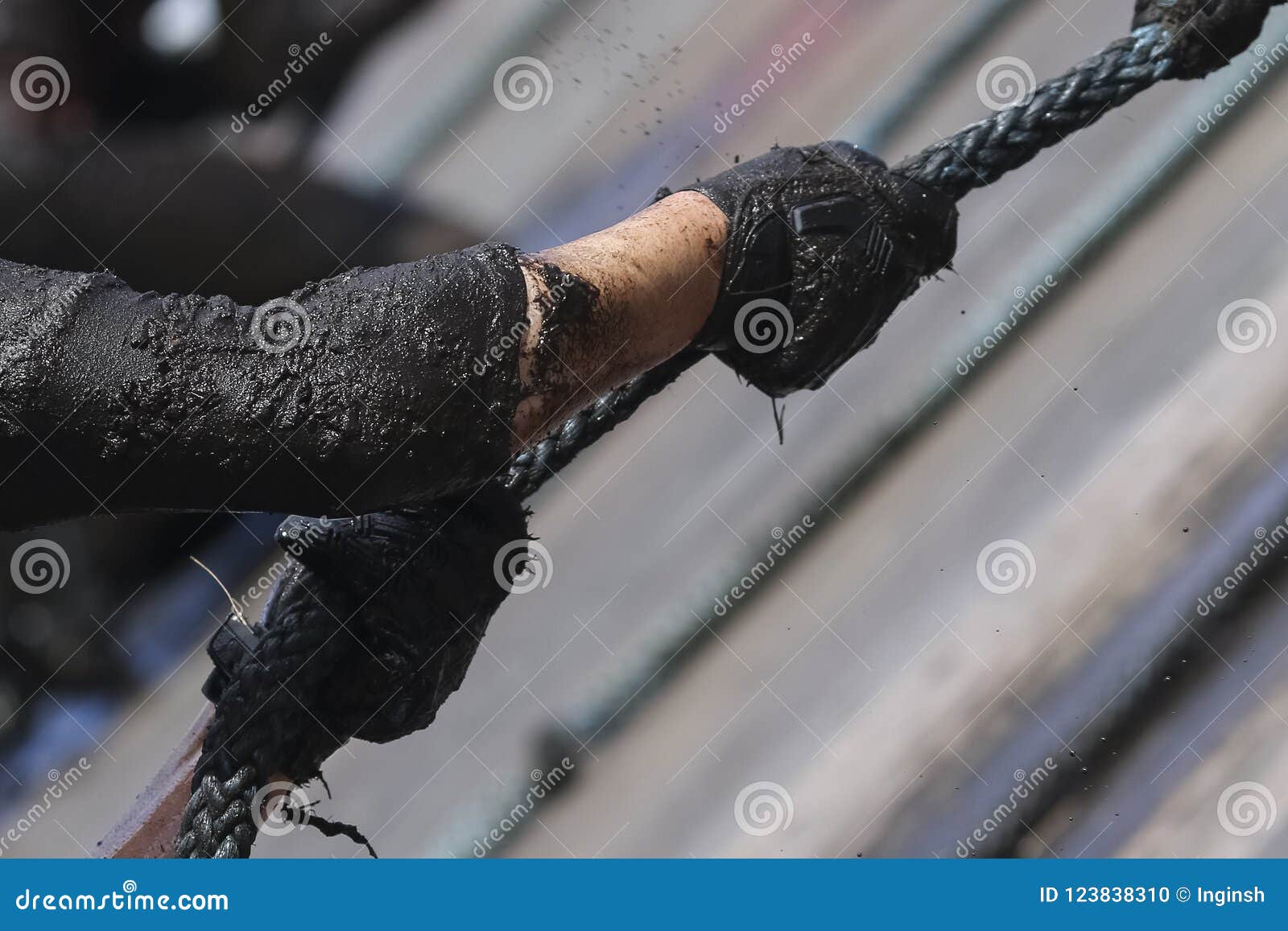 Mud Race Runners,defeating Obstacles By Using Rope Stock Photography ...