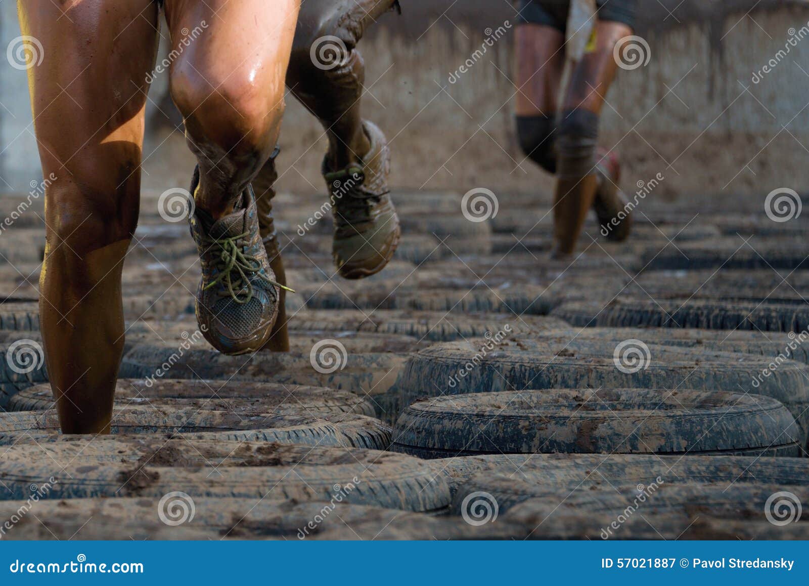 Mud Race Runners,defeating Obstacles By Using Rope Stock Photography ...