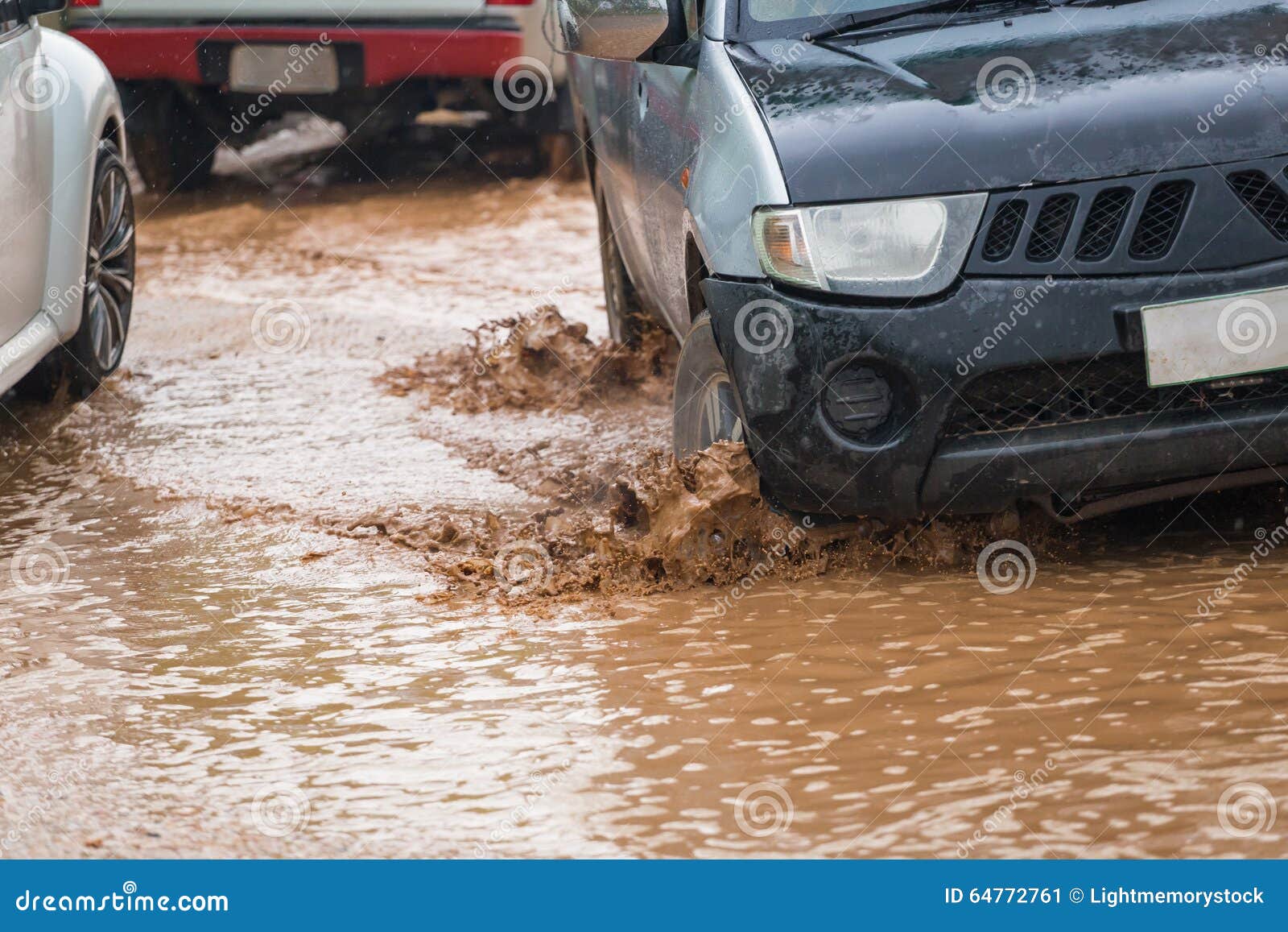 Mud Splash by a Car As it Goes through Flood Water Stock Image - Image ...