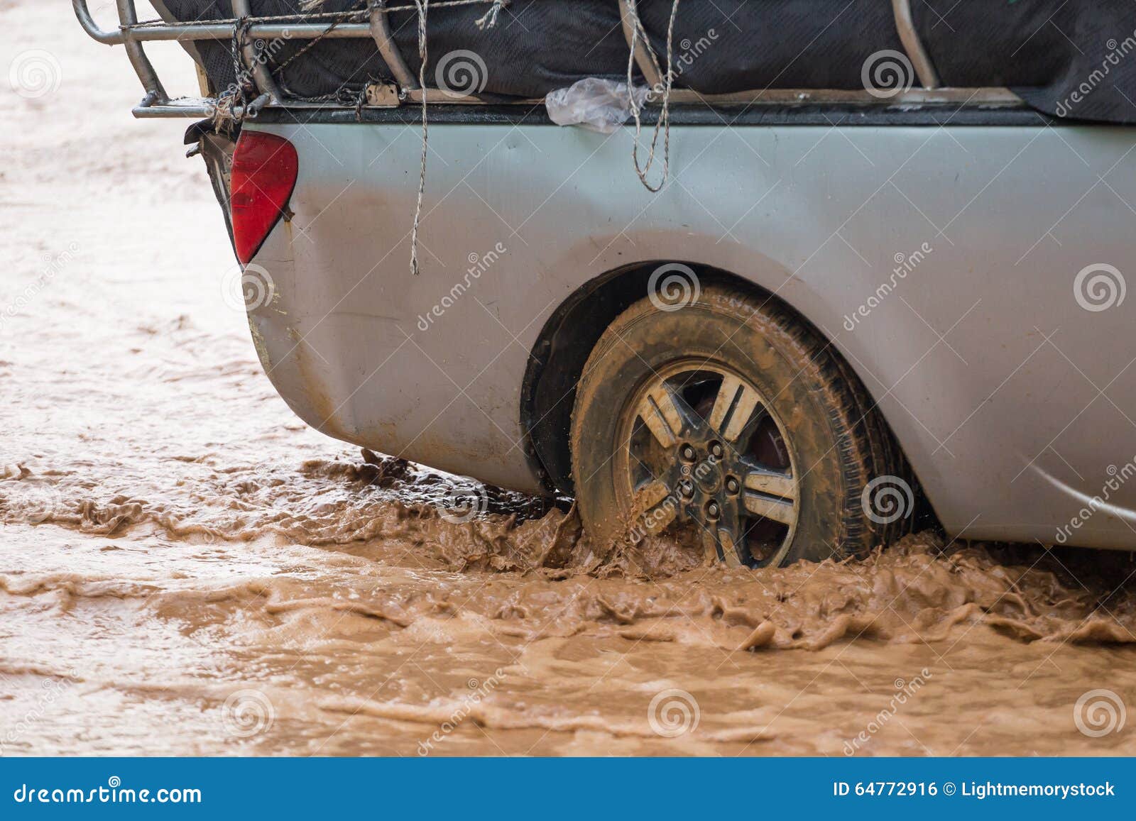 Mud Splash by a Car As it Goes through Flood Water Stock Photo - Image ...