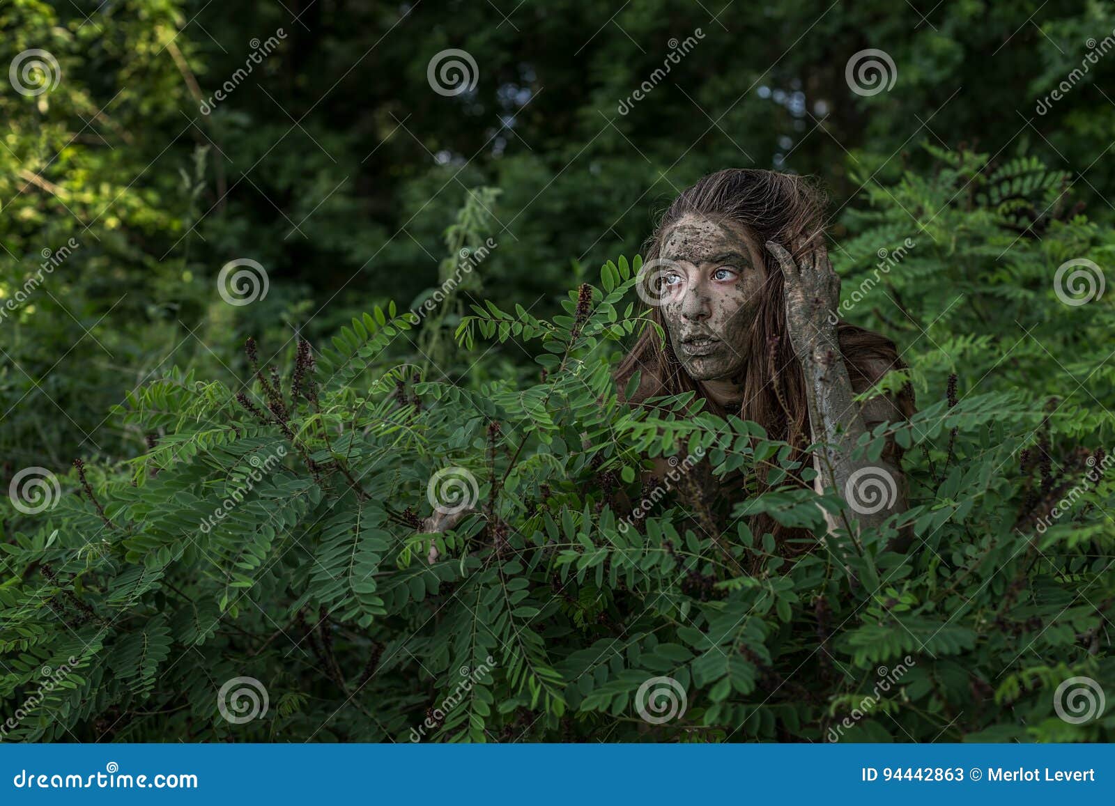 Muddy Amazon Girl Hiding Behind a Bush in the Woods Stock Image - Image ...