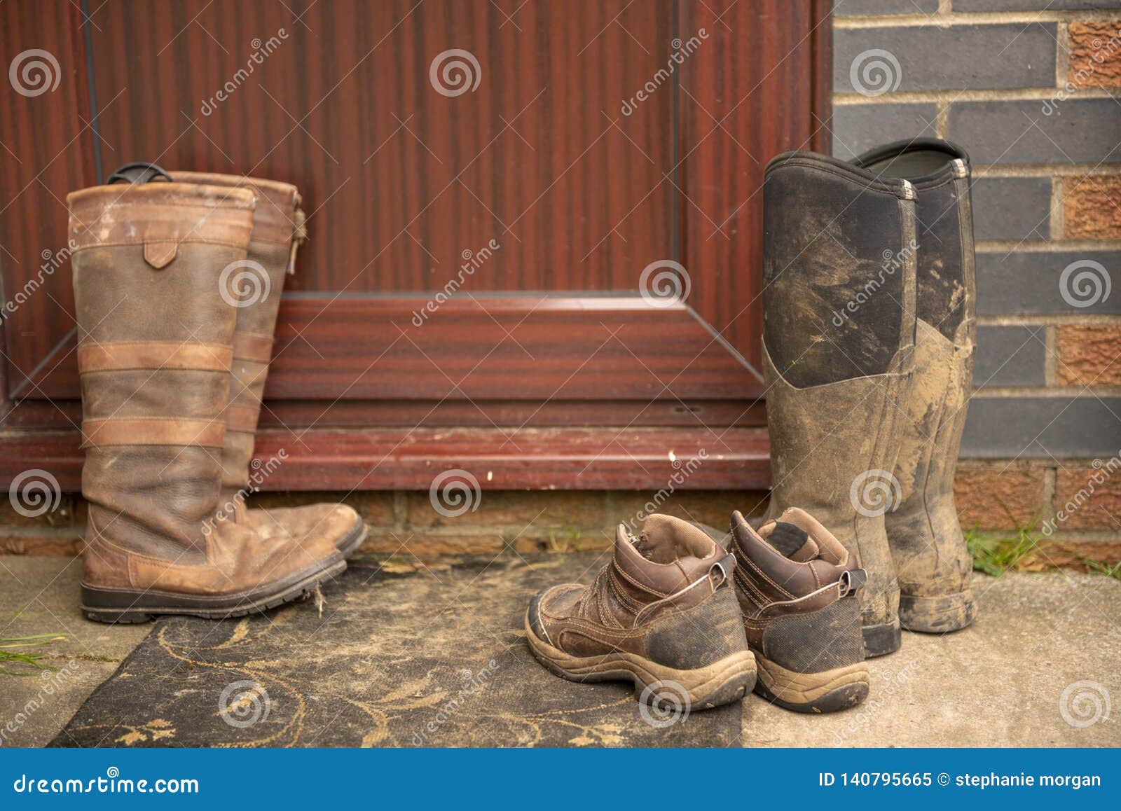 Old Muddy Boots Are Drying On The Outdoors Window Of A Multi-story ...