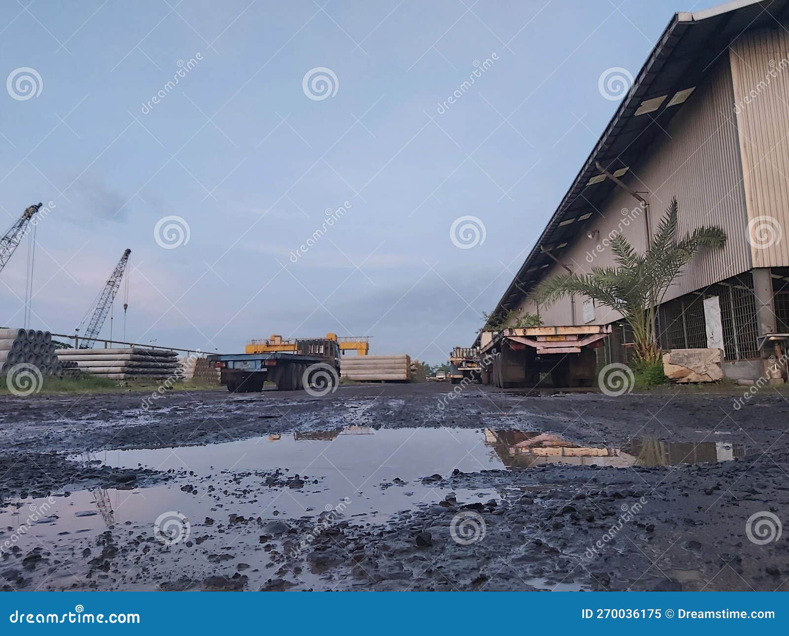 The Muddy Ground in the Factory that Reflects Off Objects Stock Image ...
