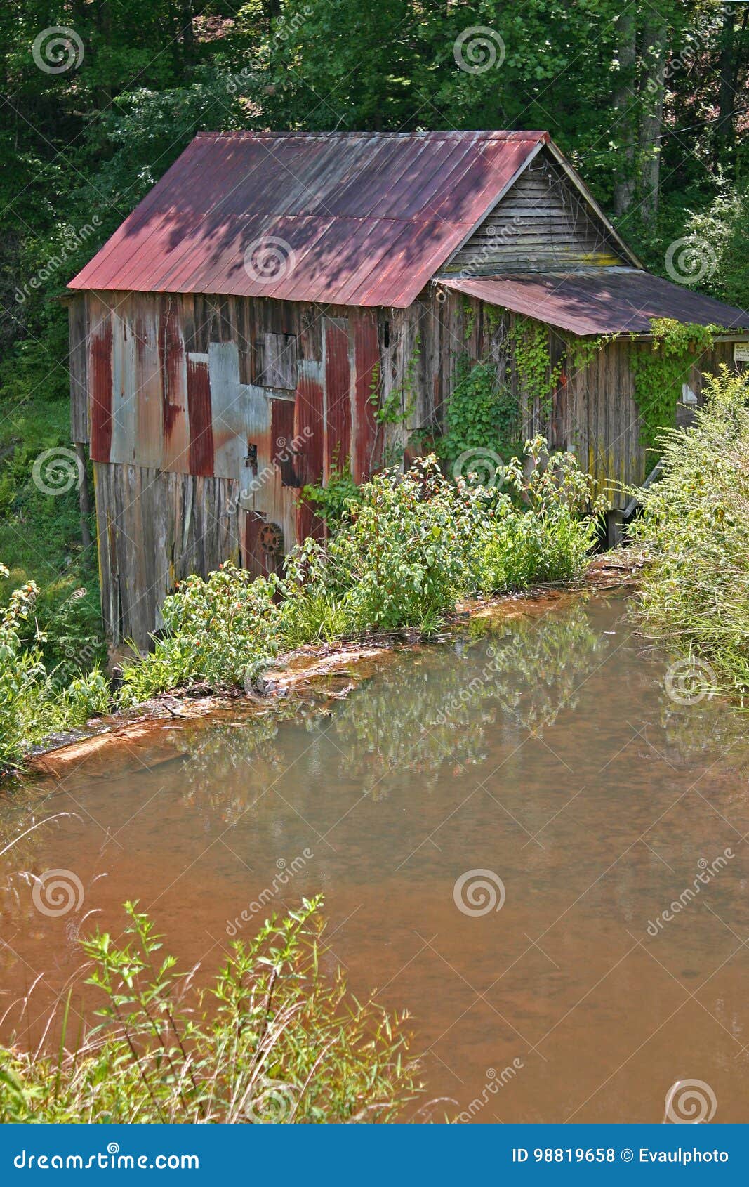 Muddy Pond & Rusty Mill Stock Photo - Image of agriculture, processing ...