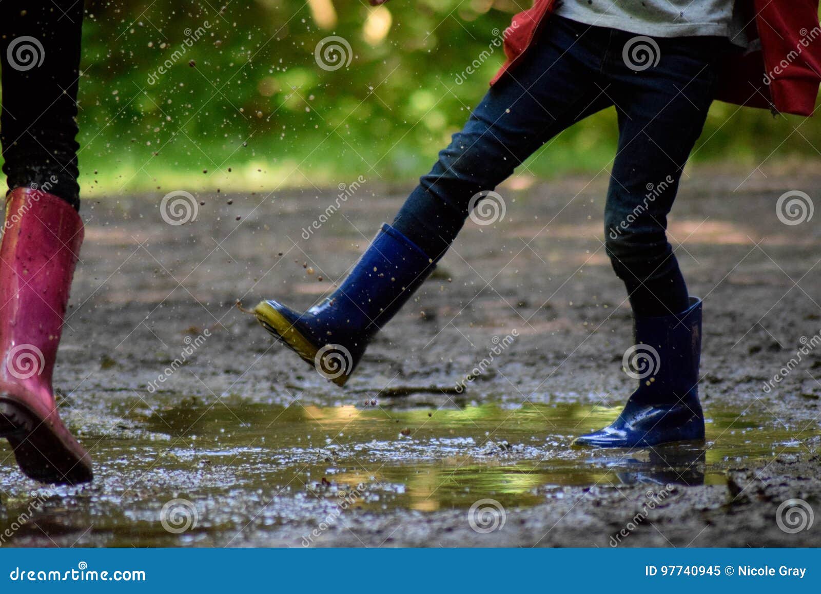 Children Splashing and Playing in a Muddy Puddle Stock Image - Image of ...
