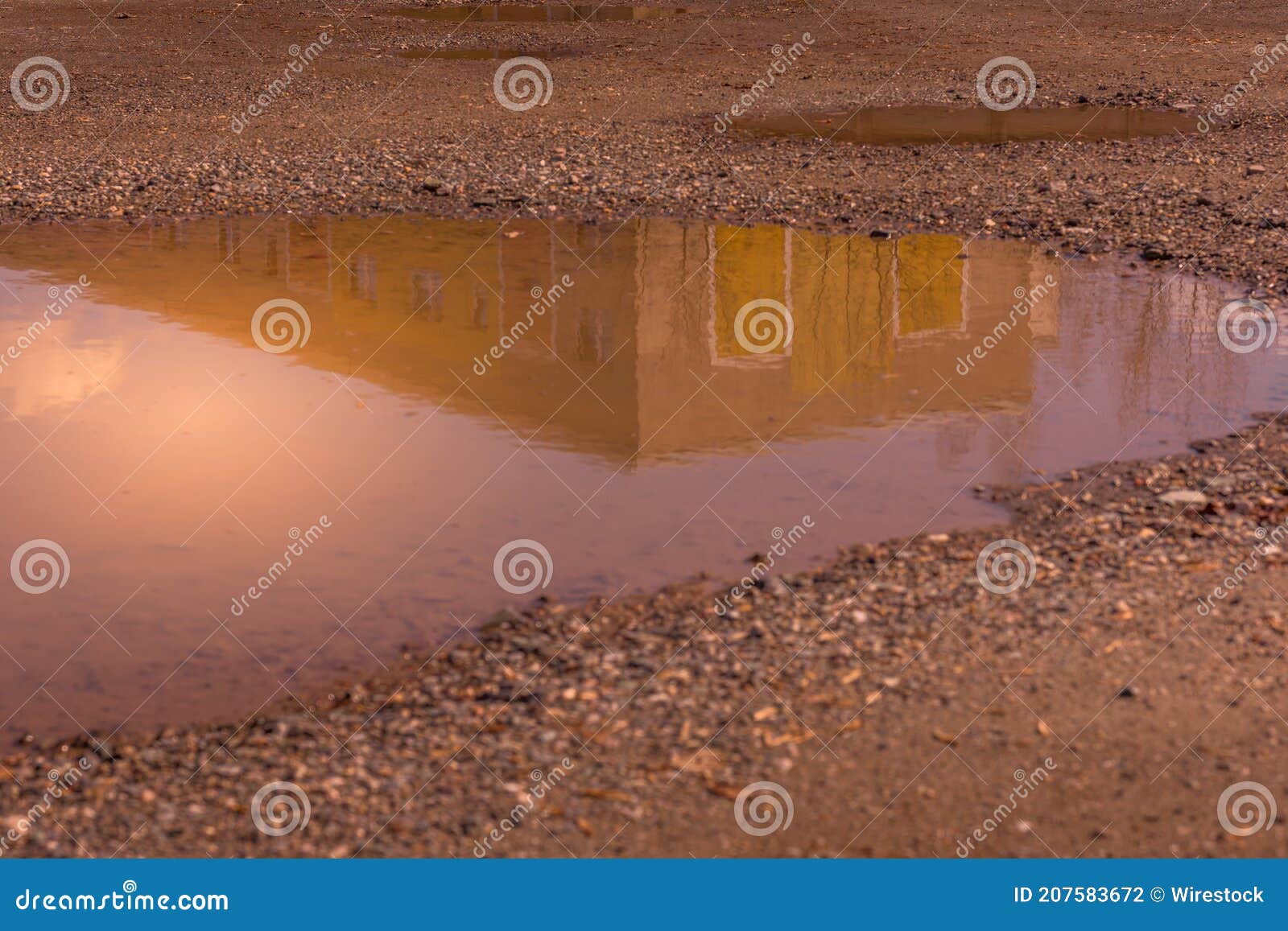 Muddy Water after a Rainy Day with Buildings Reflecting in it Stock ...