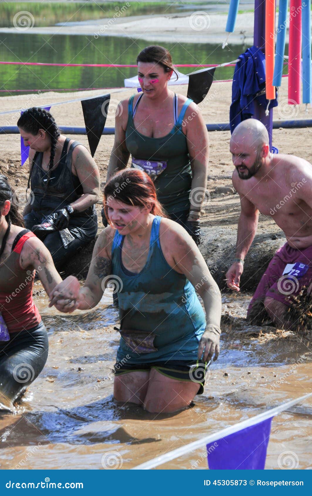 2014 Muderrella Mud Race Group Stretching Exercises Editorial Image ...