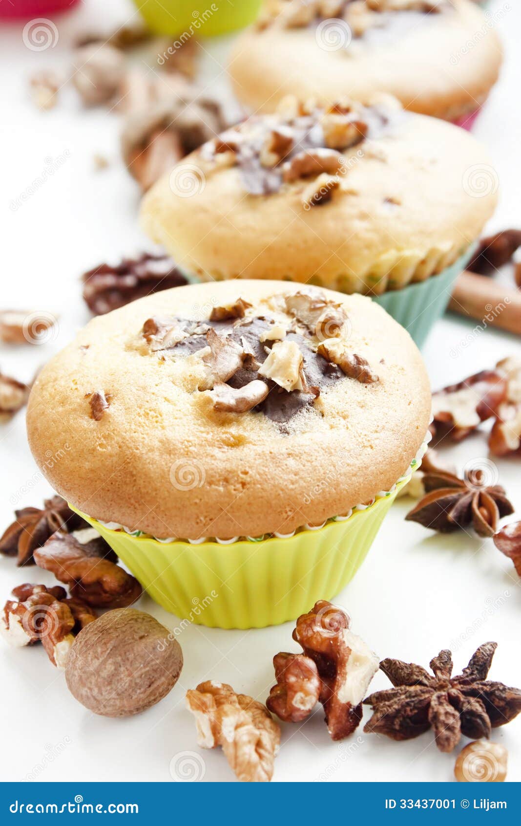 Muffins in colorful forms stock image. Image of portion - 33437001