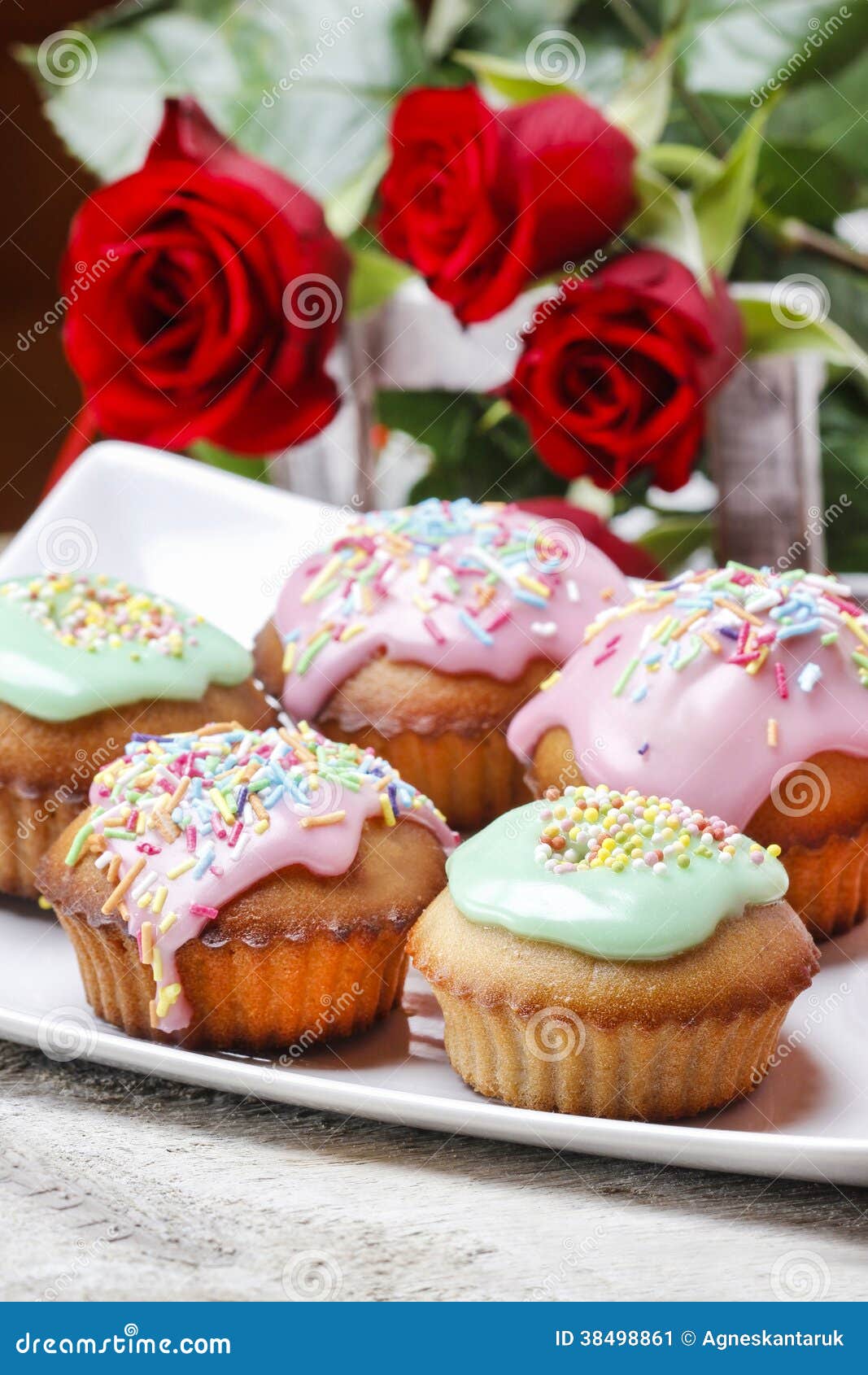 Muffins Covered with Pink Icing and Colorful Sprinkles Stock Image ...
