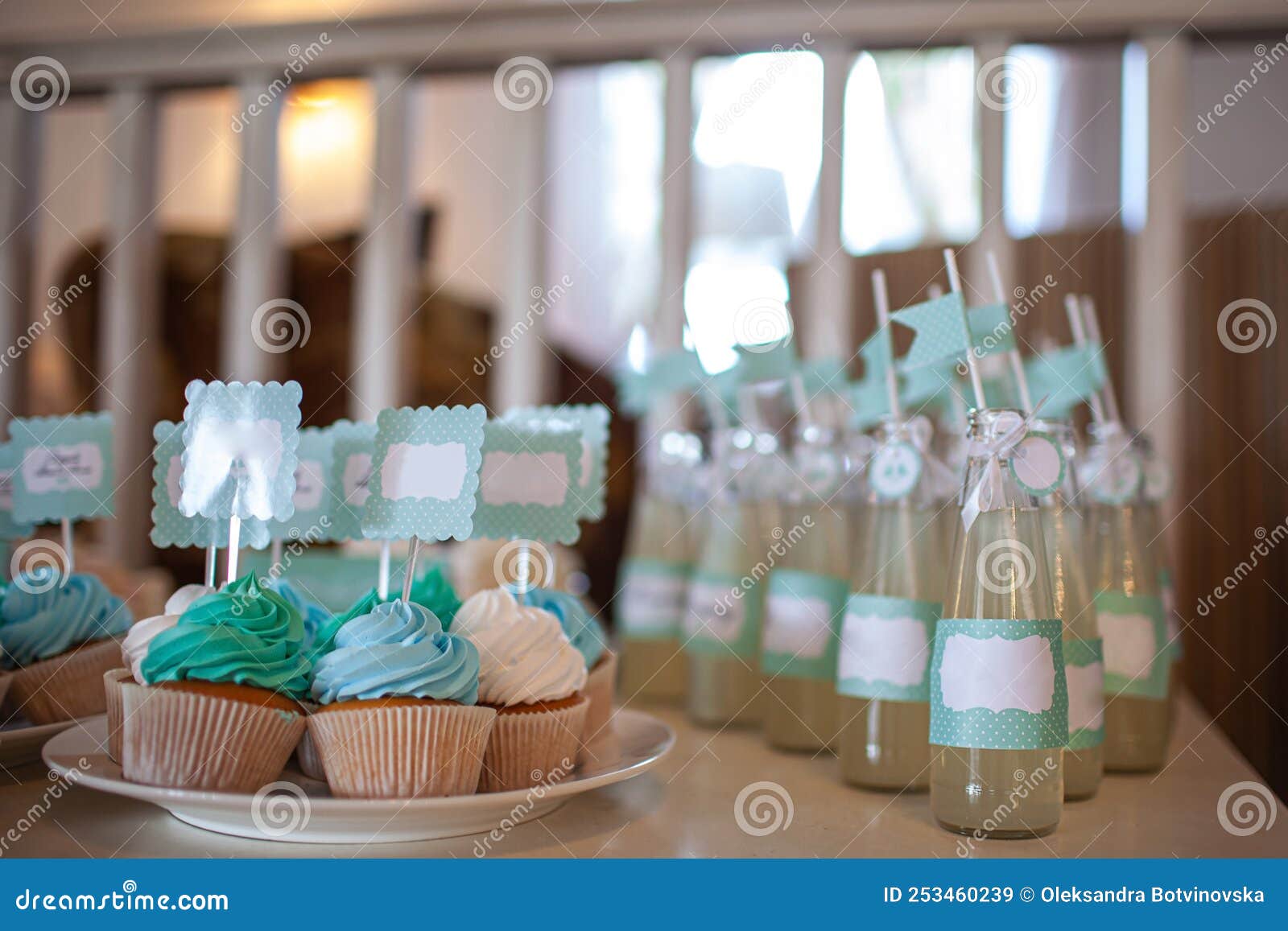 Muffins on a Plate Decorated with Multi-colored Cream Stock Image ...
