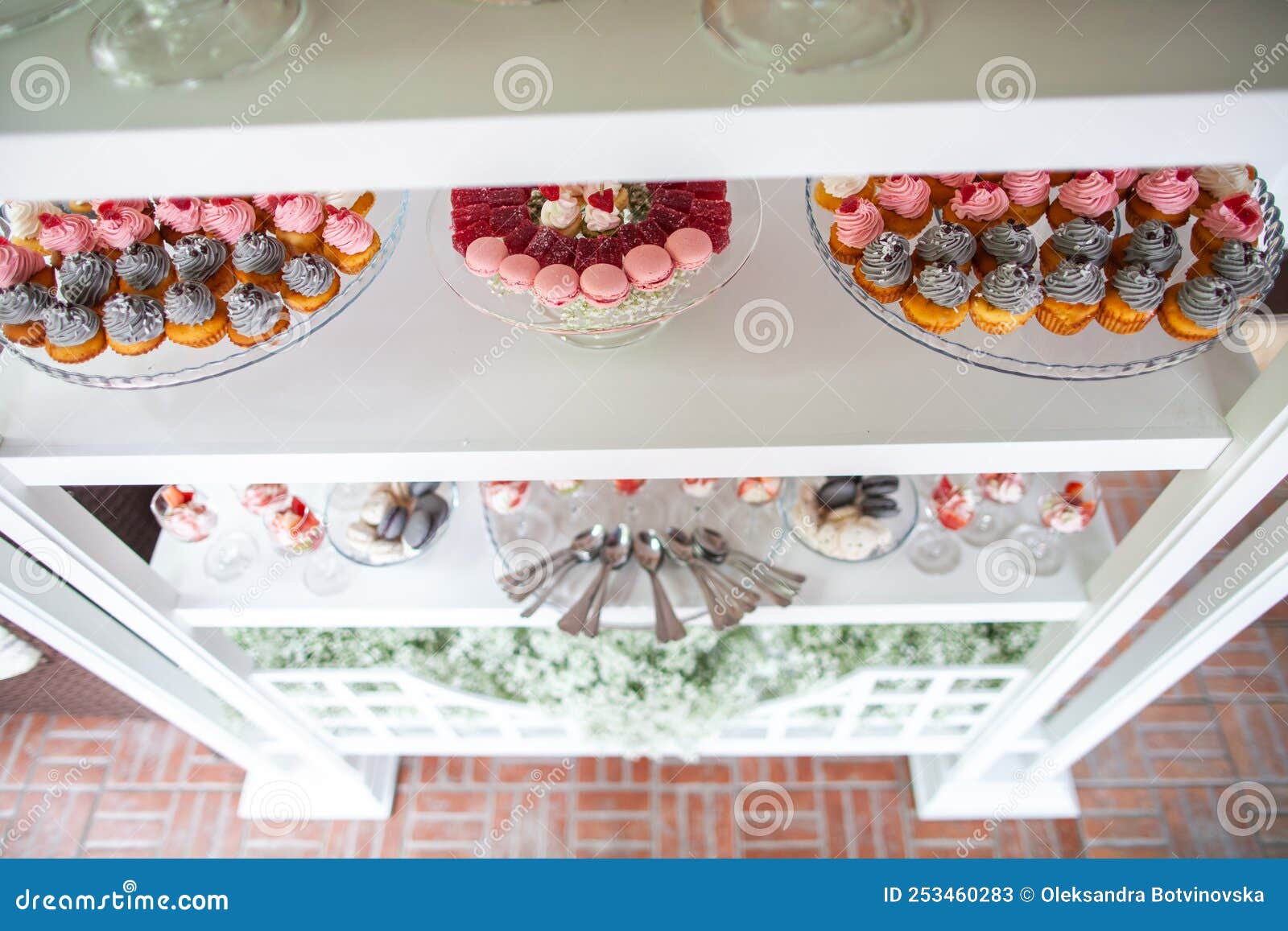 Muffins on a Plate Decorated with Multi-colored Cream Stock Image ...