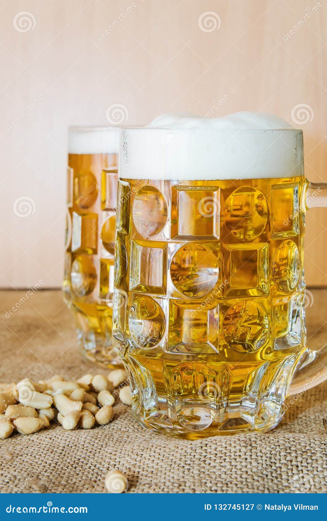 Mug with Beer and Salted Peanuts on the Table Stock Image - Image of ...