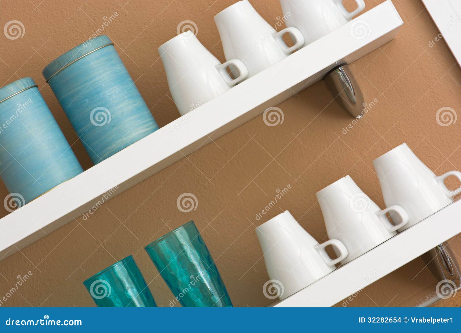 Mugs and cups on the shelf stock photo. Image of objects - 32282654