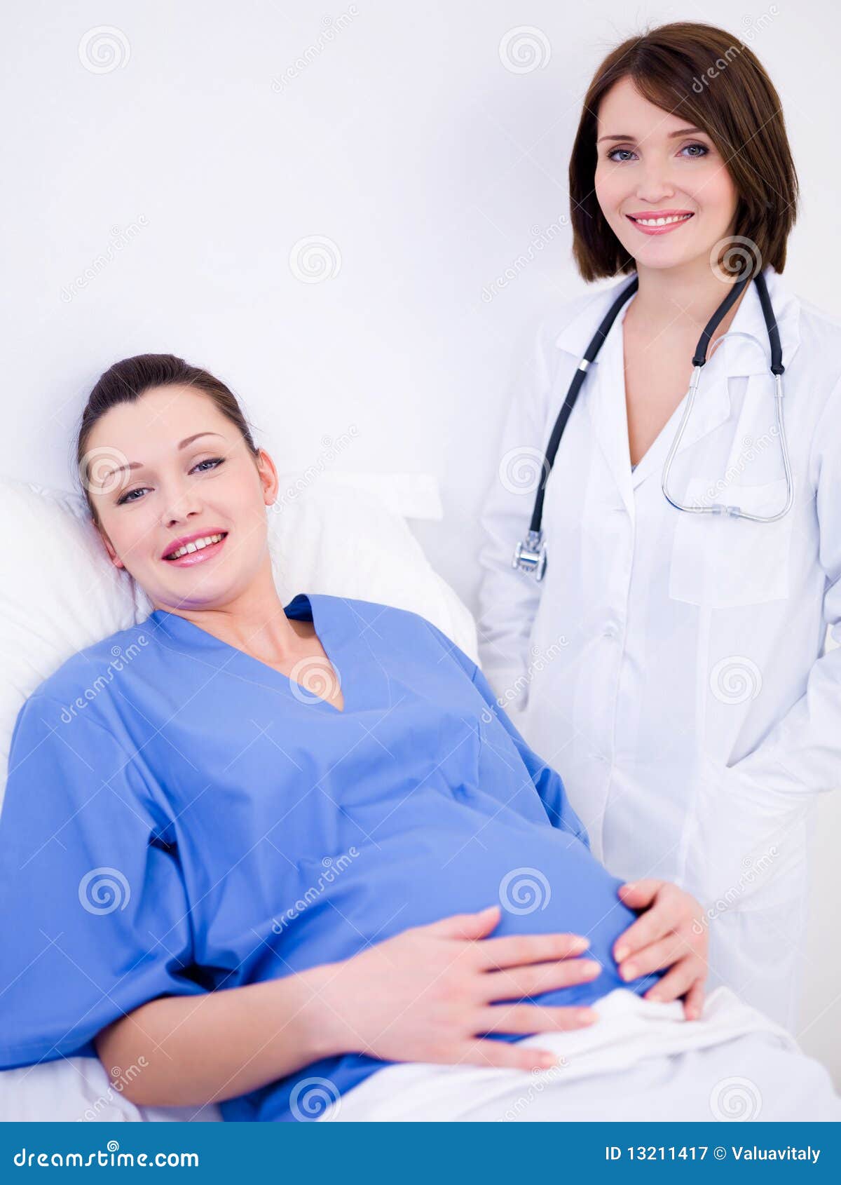 Mujer y doctor reinantes imagen de archivo. Imagen de feto - 13211417