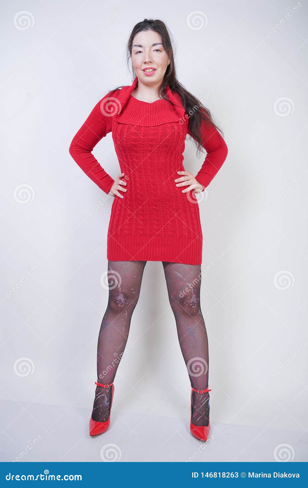 Pretty Asian Chubby Woman Posing In Red Knitted Dress And Black