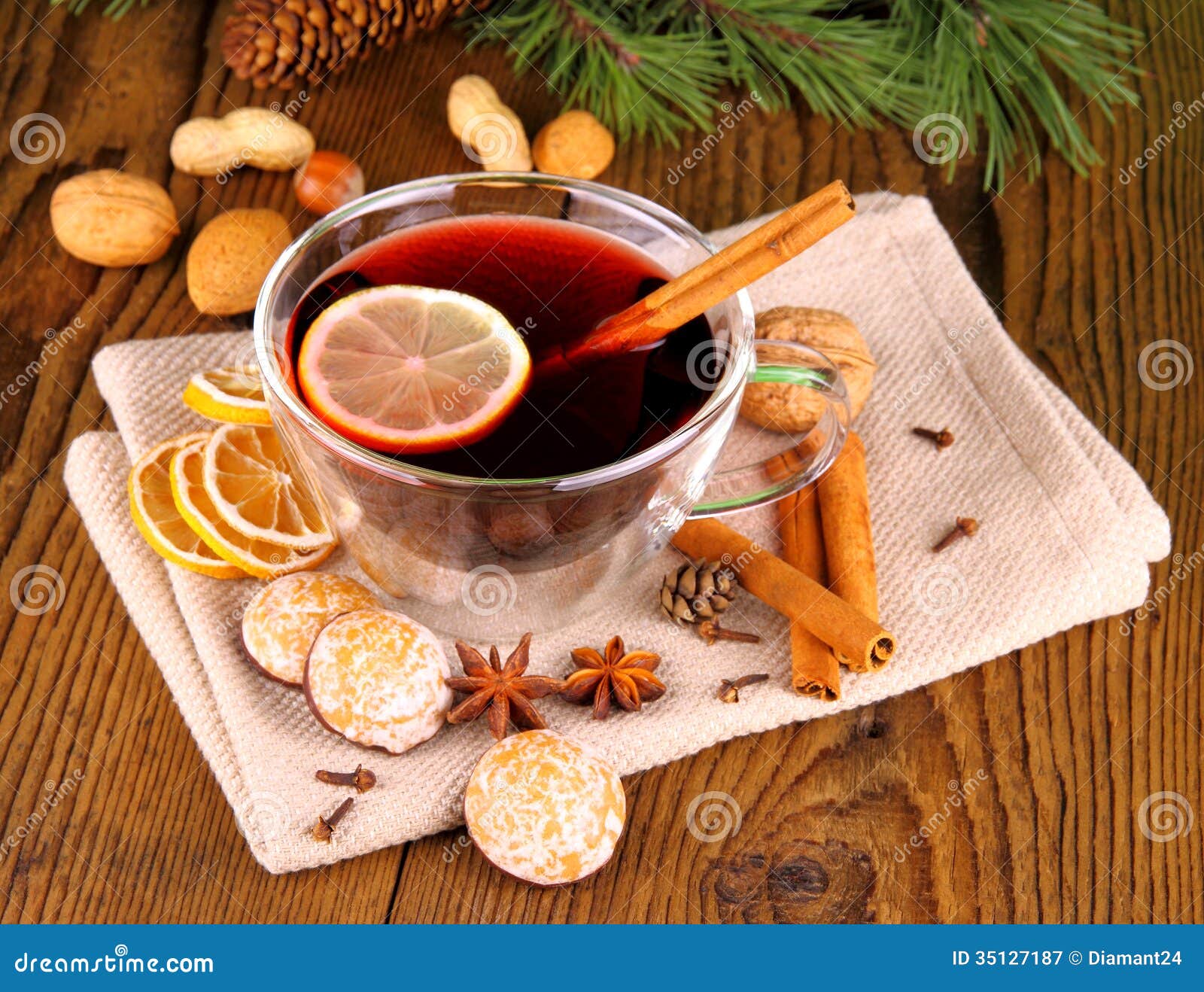 Mulled Wine in Glass with Cinnamon Stick, Gingerbread and Nuts Stock ...