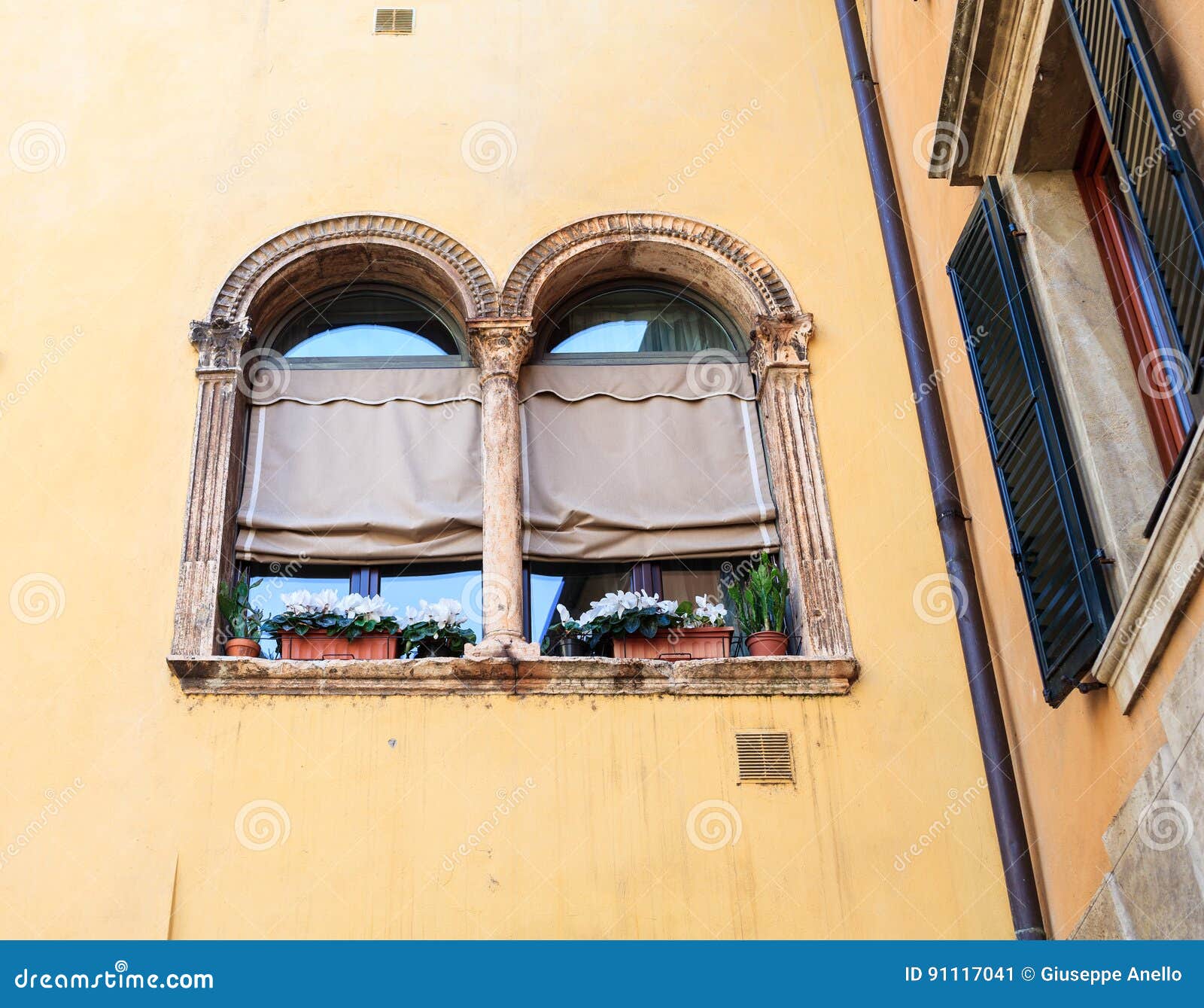 Mullioned window in Verona stock image. Image of exterior - 91117041