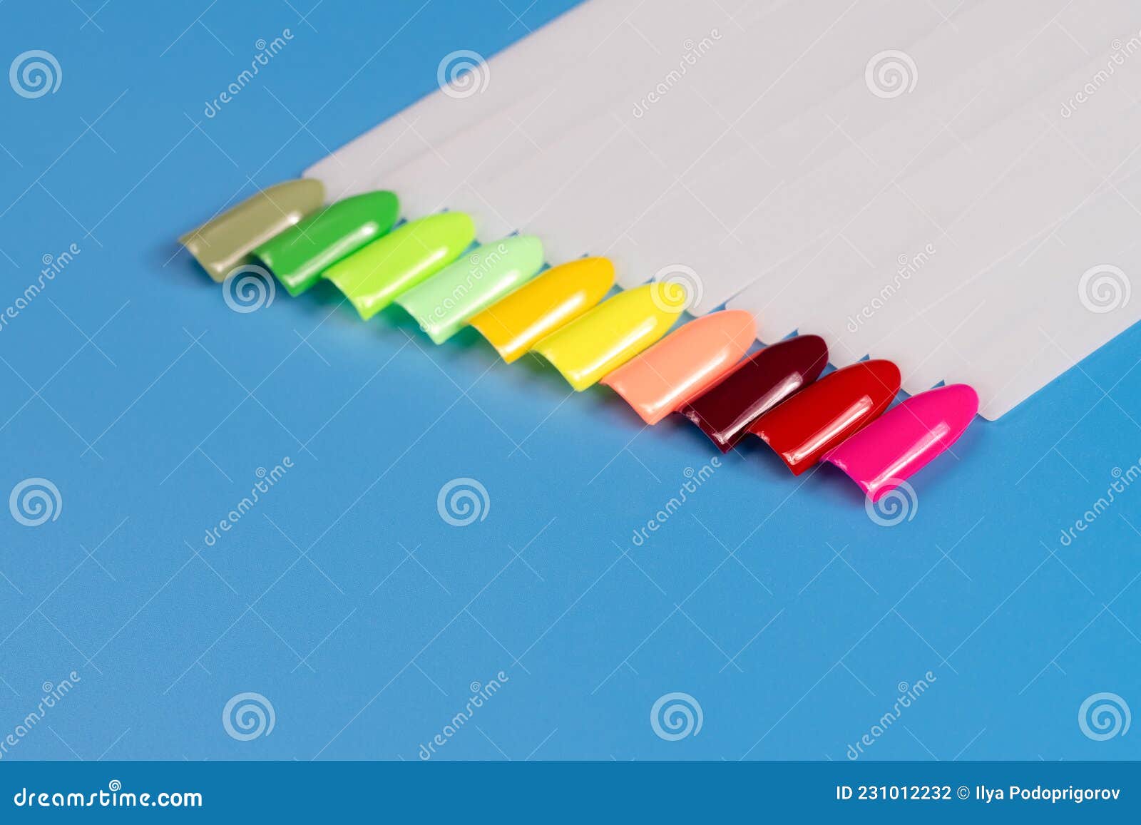 Multiсolor Nail Tips on a Blue Background. Examples of Manicure for ...