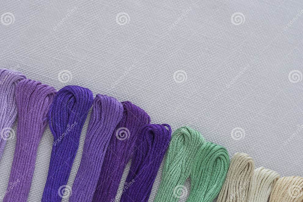 Multi-color Embroidery Threads on White Canvas. Place for Text Stock ...