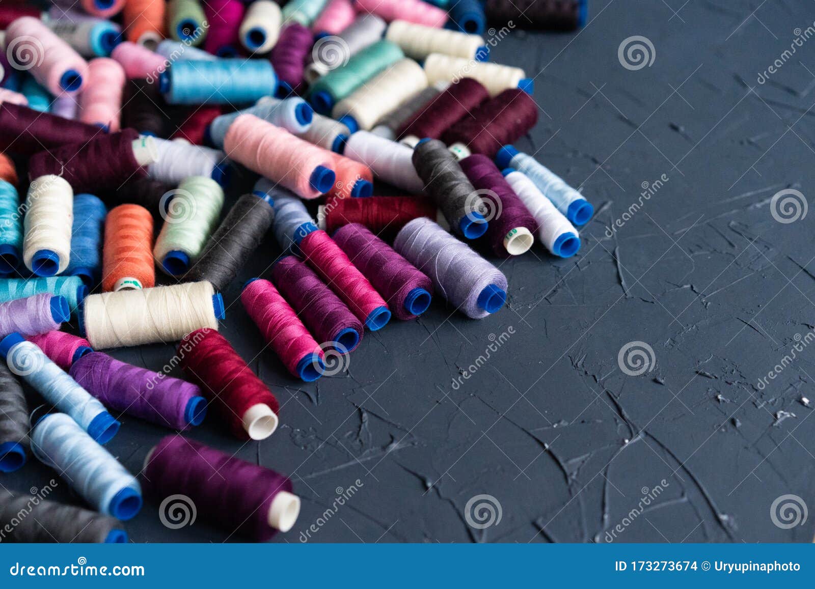 A Lot of Sewing Colored Thread. Thread Reels. Colorful Threads in the ...
