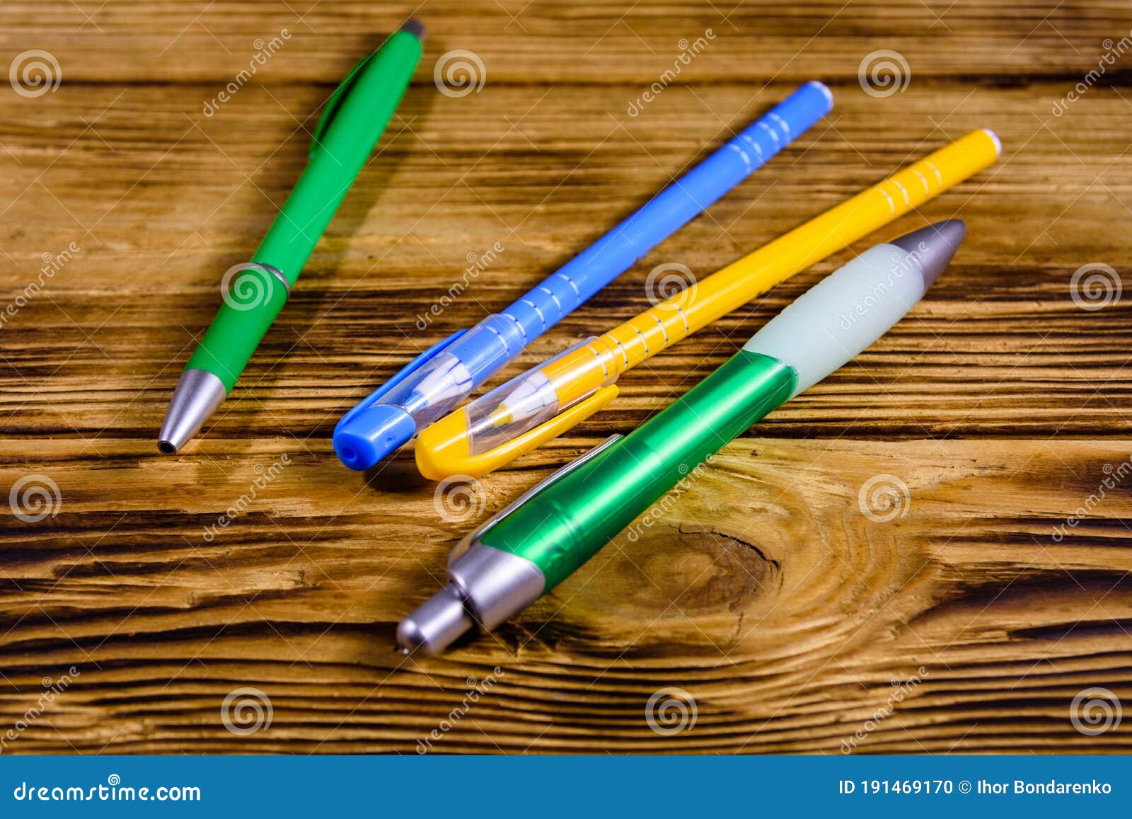 Multi Colored Ball Pens on a Wooden Table Stock Photo - Image of green ...