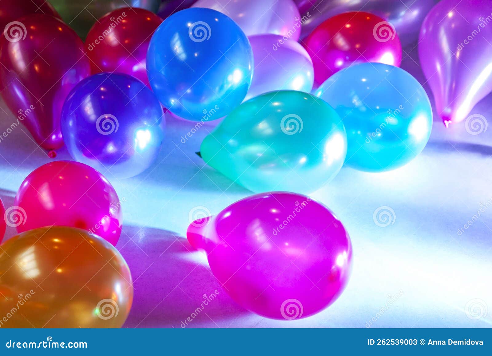 Multi-colored Balloons on the Floor in the Light of Spotlights. Events ...
