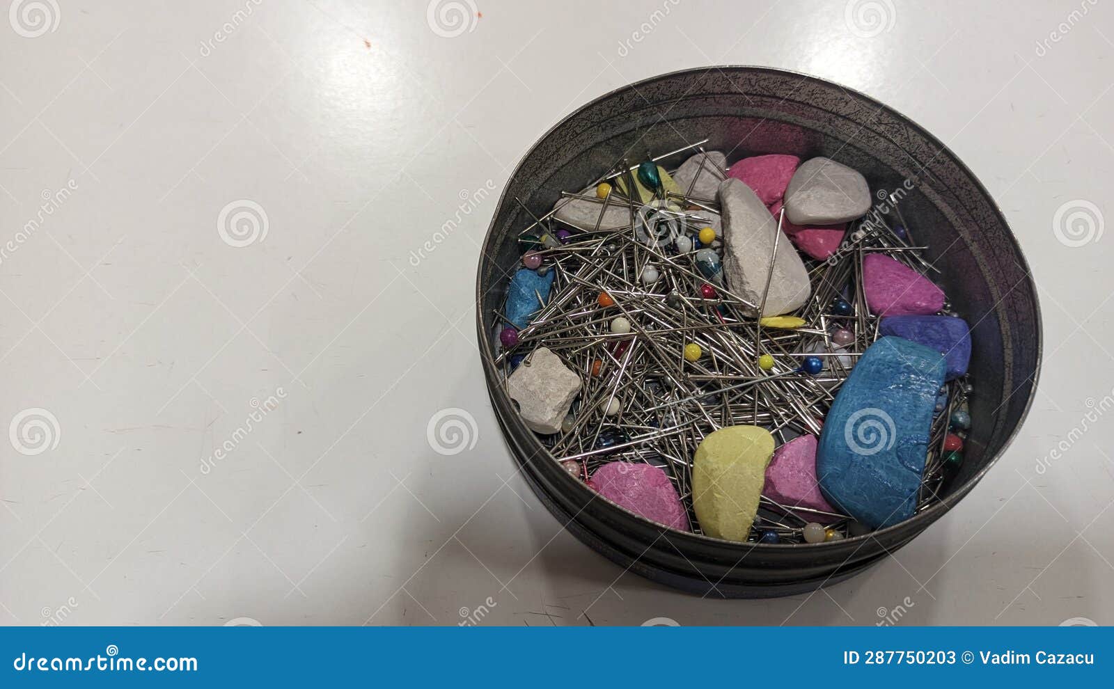 Multi-colored Pieces of Soap, Chalk and Needles are in a Tin Can in a ...
