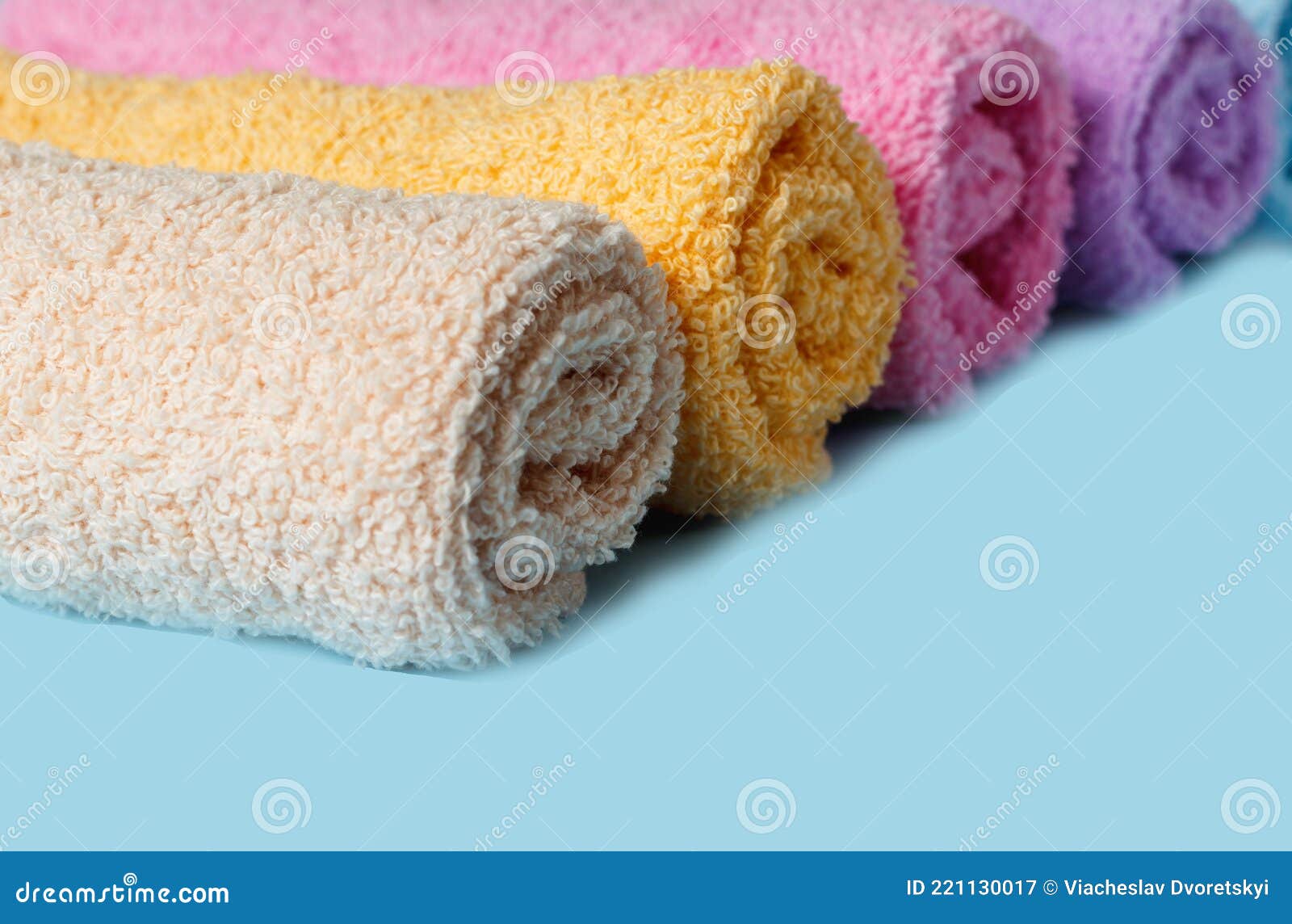 Multi-colored Bath Towels, Rolled. Set of Towels. Spa Concept. Isolated ...