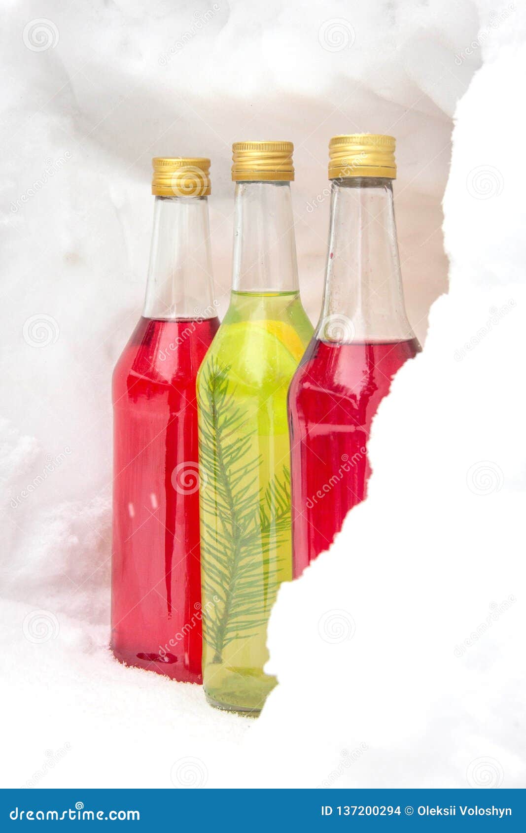 Bottles with Alcohol in the Snow.Multi-colored Bottles Stock Photo ...