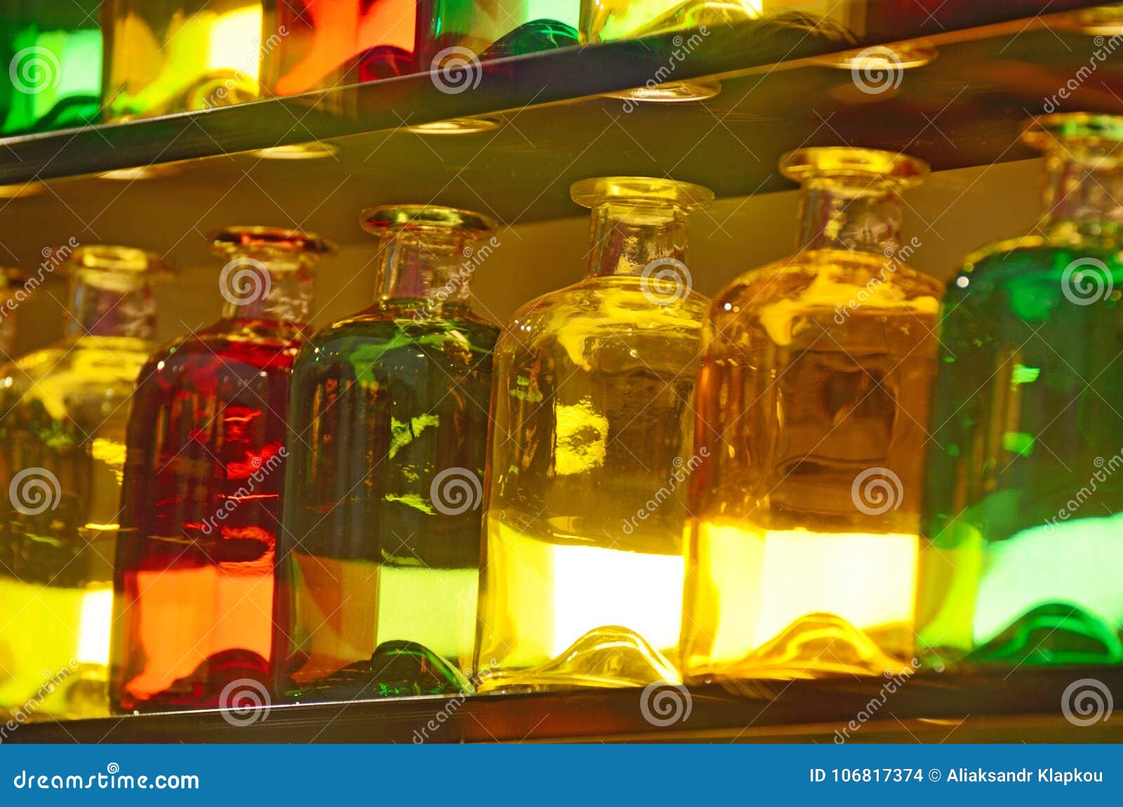 Multi-colored Bottles in the Window. Stock Photo - Image of green ...