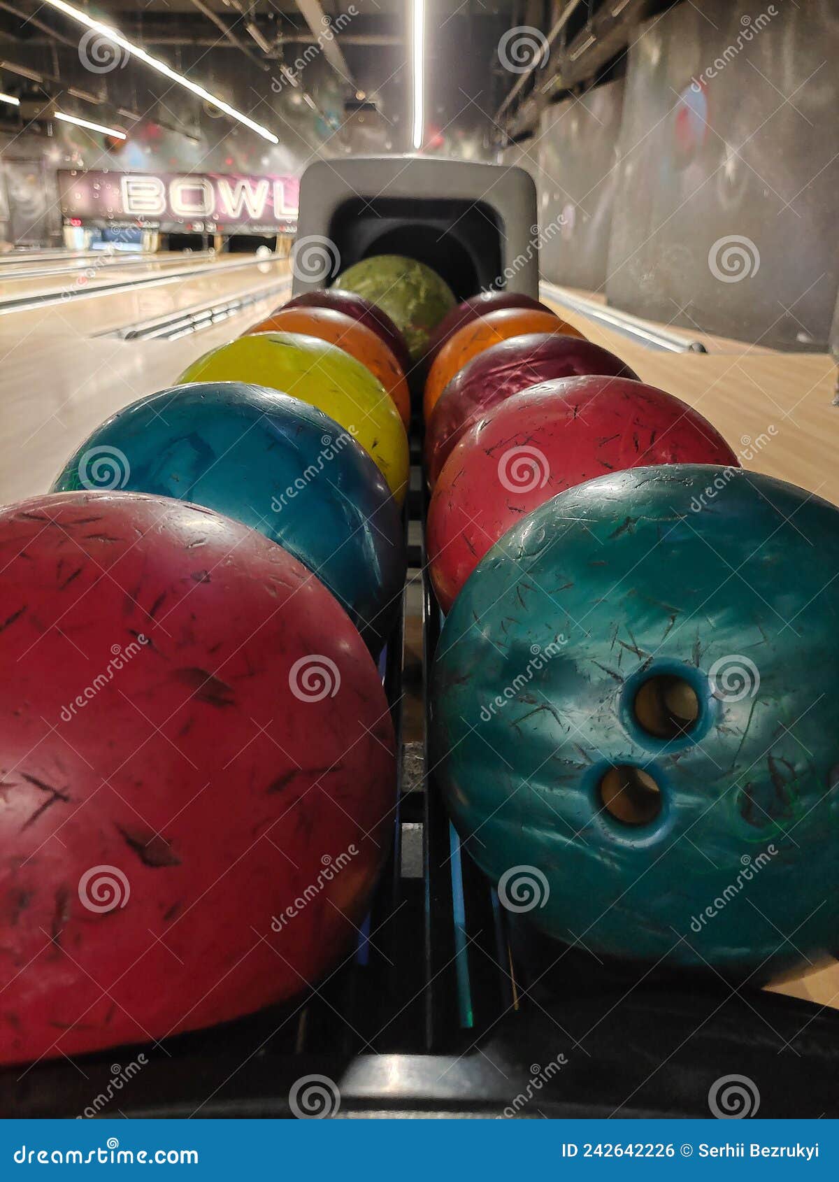 Bowling Balls of Different Colors Lie in Two Rows on a Bowl Stand Stock ...