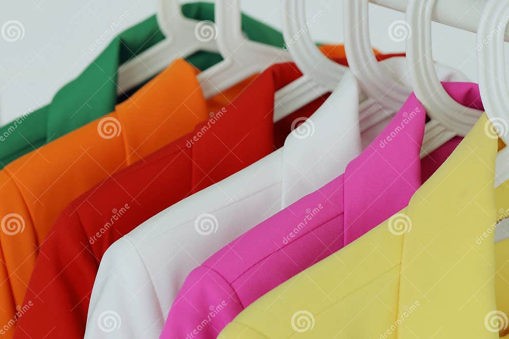 Multi-colored Bright Jackets on a Hanger on a White Background Stock ...